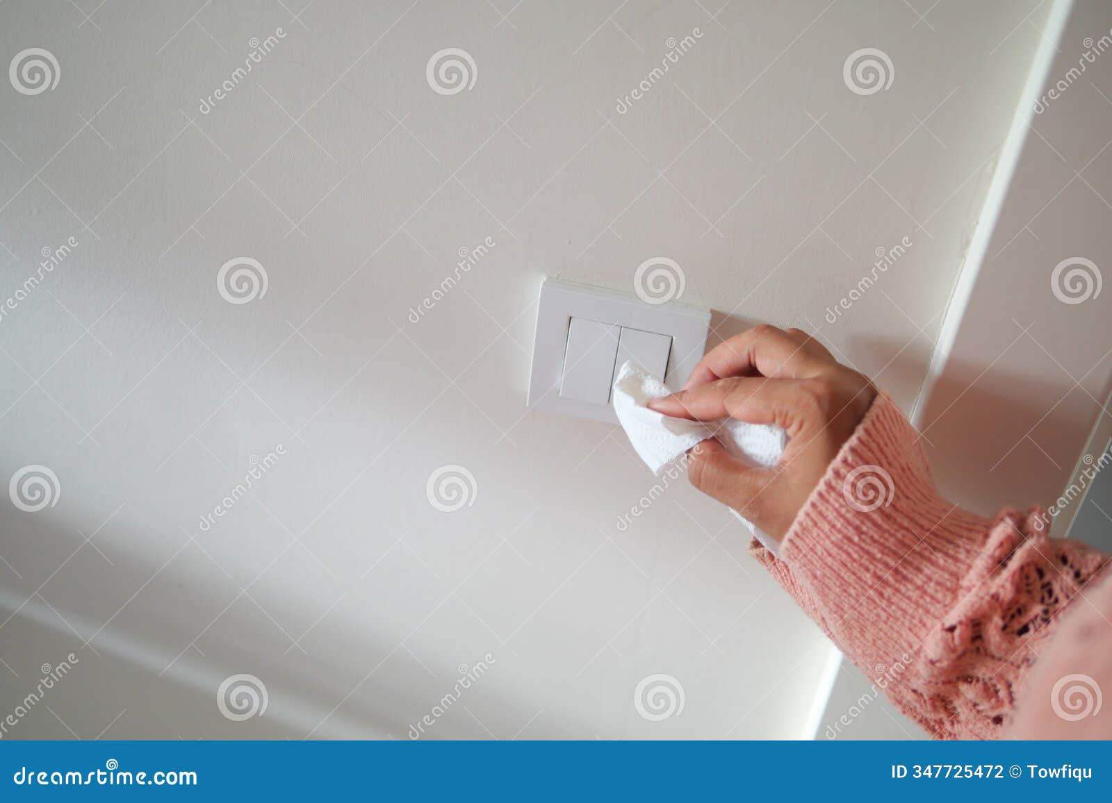 Hand with Cloth Wiping a Light Switch at the Wall Stock Photo - Image ...