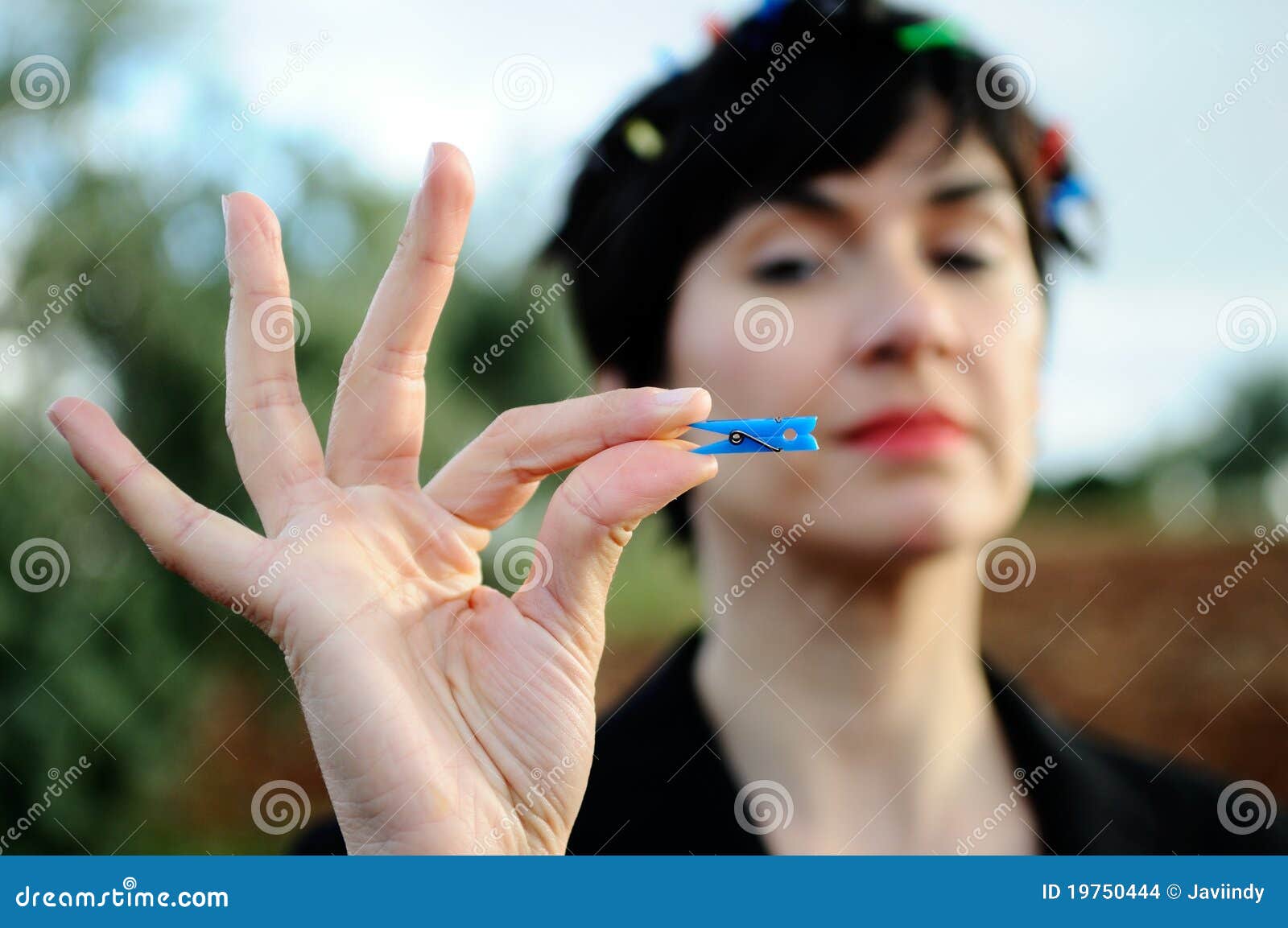 Hand with the clothespin stock photo. Image of human - 19750444