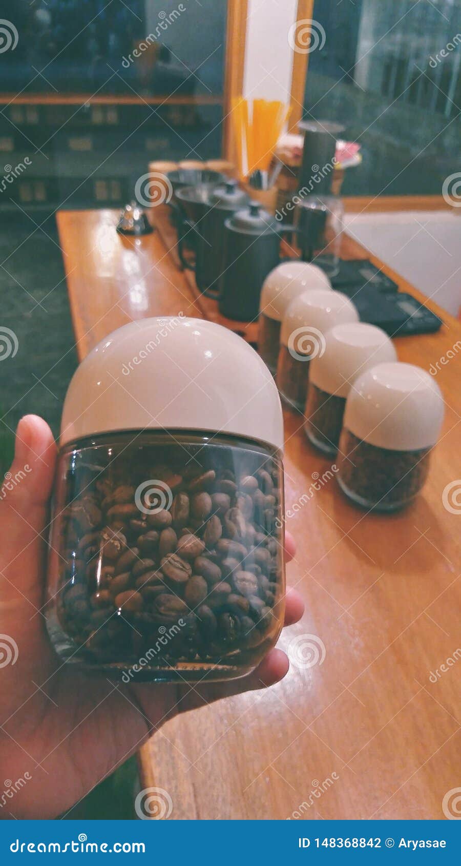 Hand on Coffee Beans stock photo. Image of coffee, beans - 148368842