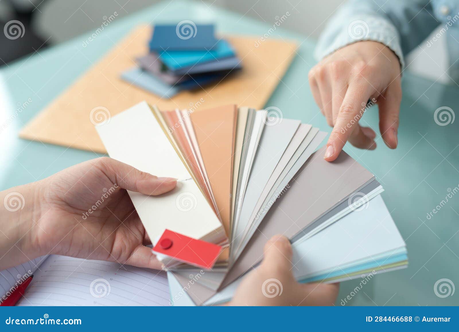 Hand and Colour Swatches Book Stock Photo - Image of pantone, choosing ...