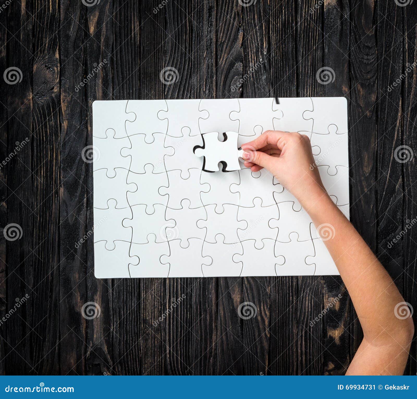 Hand Completing Wthite Puzzle with the Last Piece Stock Image - Image ...