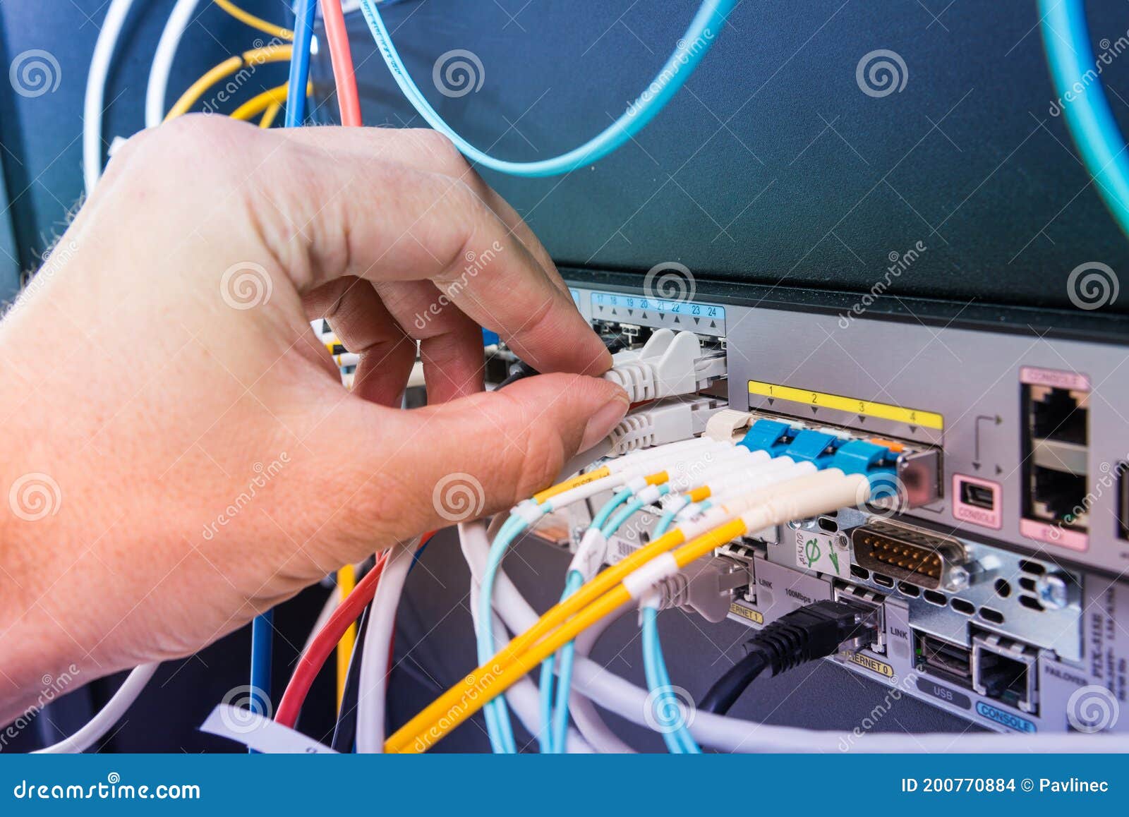 Hand of Computer Engineer Connecting Fiber Optic Cable in Server Stock ...