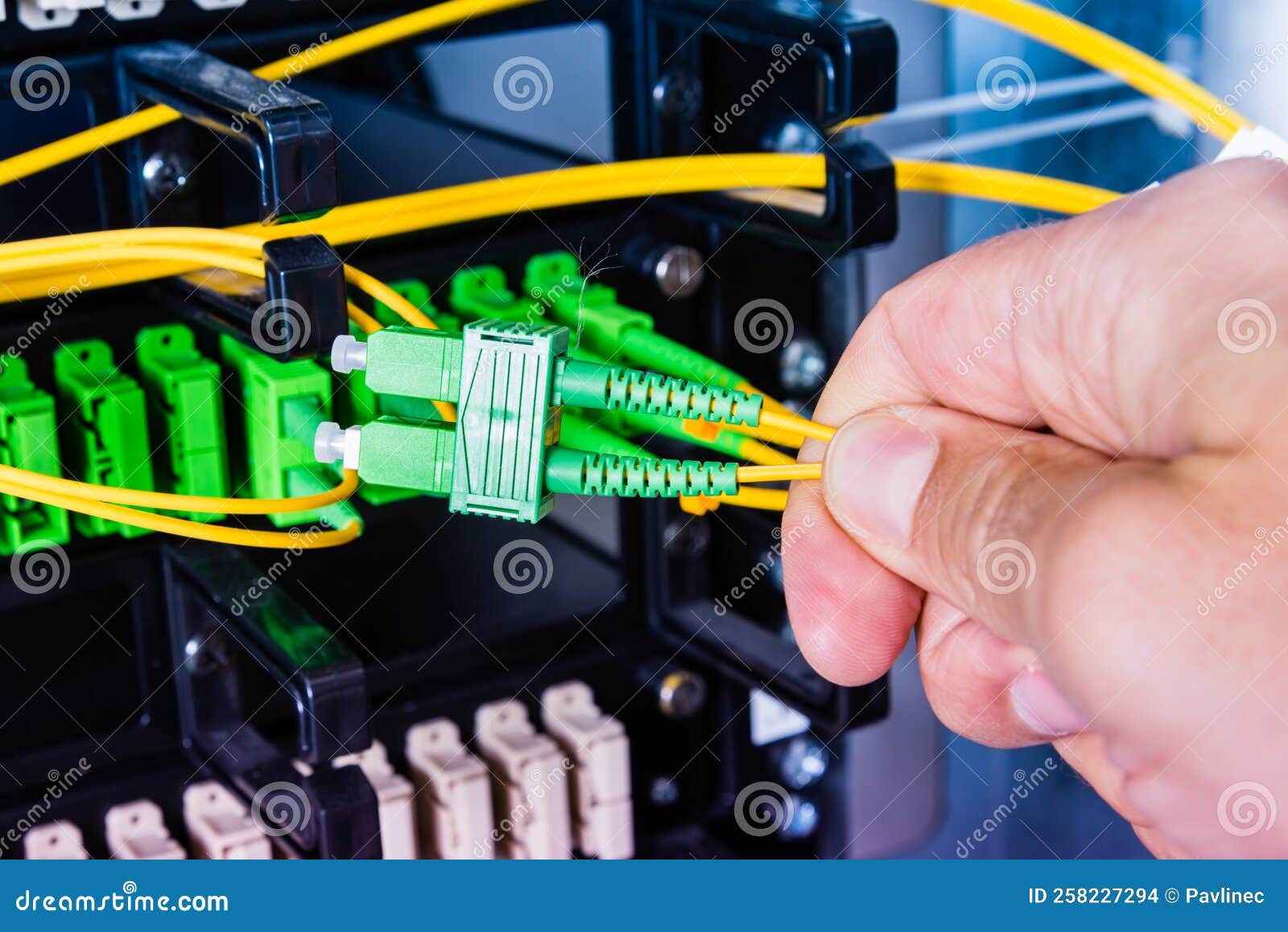 Hand of Computer Engineer Connecting Fiber Optic Cable in Server Stock ...