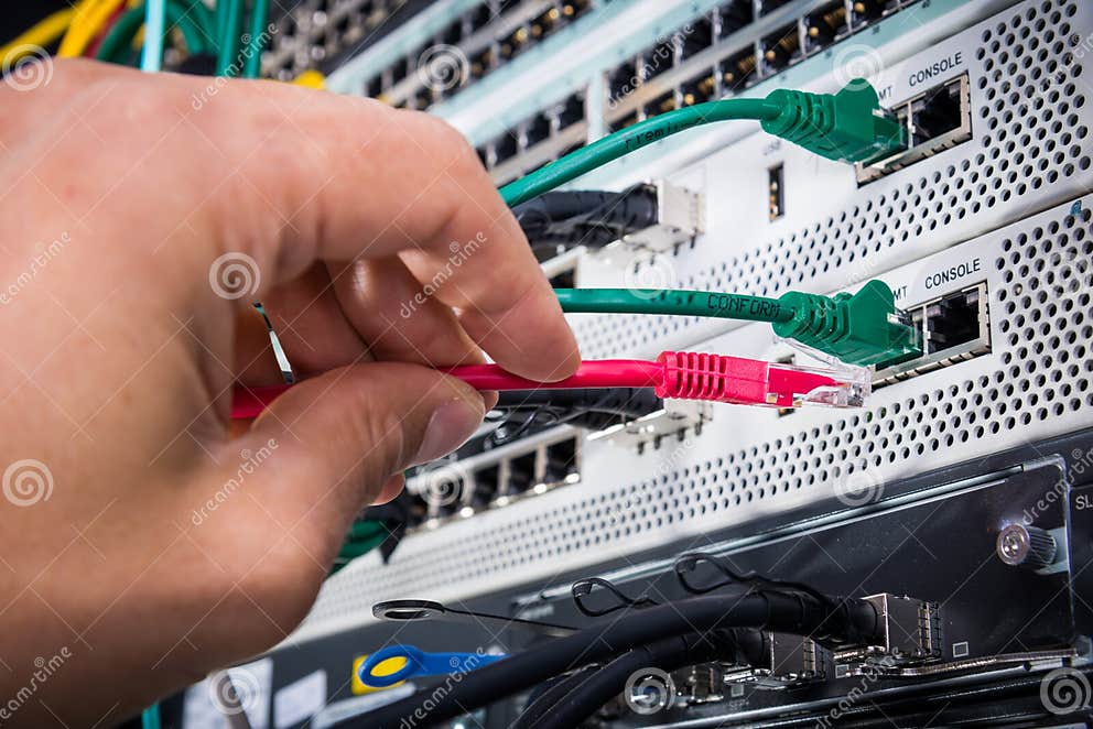 Hand of Computer Engineer Connecting Network Cable in Server Cab Stock ...