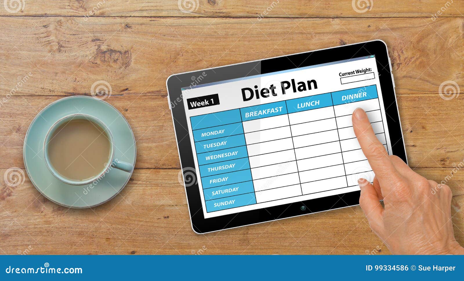 Hand with Computer Tablet Completing Diet Plan App on Table with Coffee ...