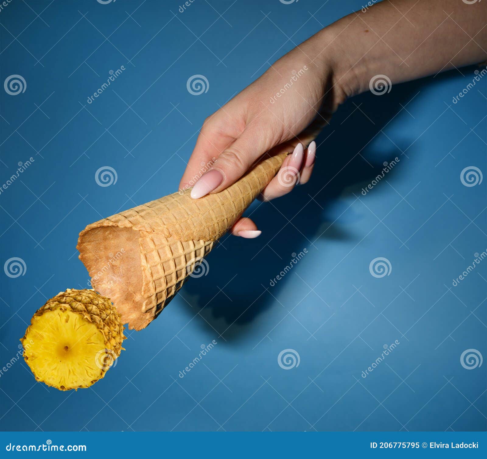 A Hand with a Cone from Which a Citrus Fruit Falls Out Stock Image ...