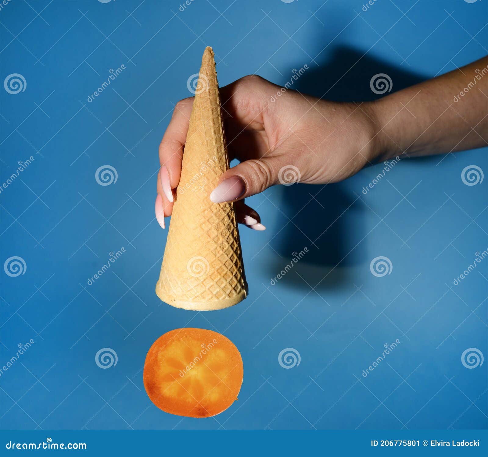 A Hand with a Cone from Which a Citrus Fruit Falls Out Stock Image ...