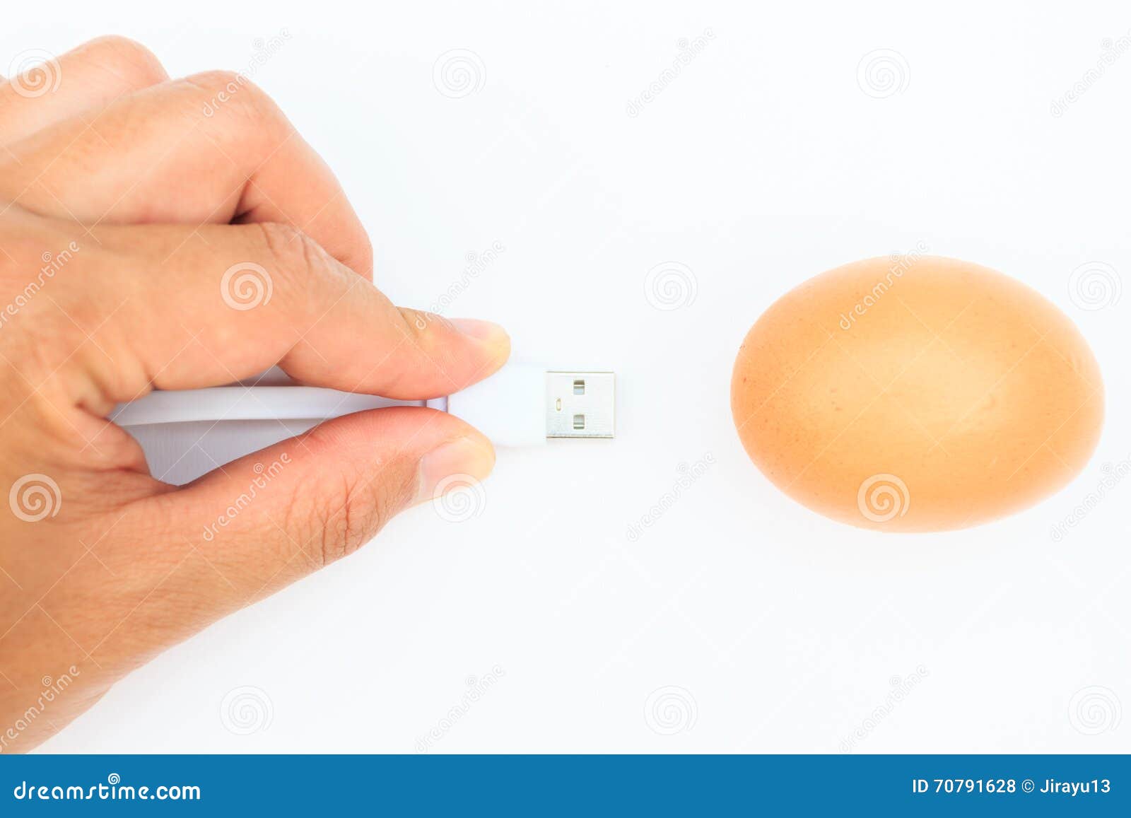Hand connecting USB to egg stock photo. Image of plug - 70791628