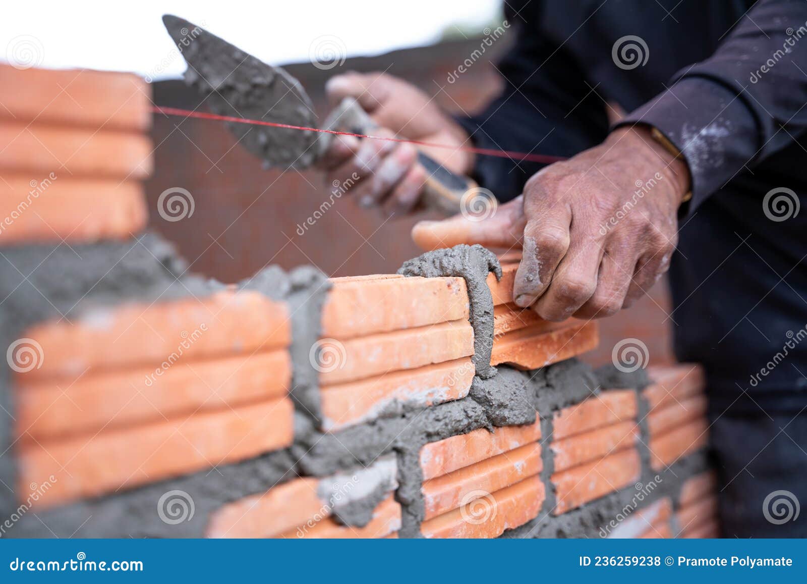 A Hand of Construction Worker, Industrial Bricklayer Installing Bricks ...