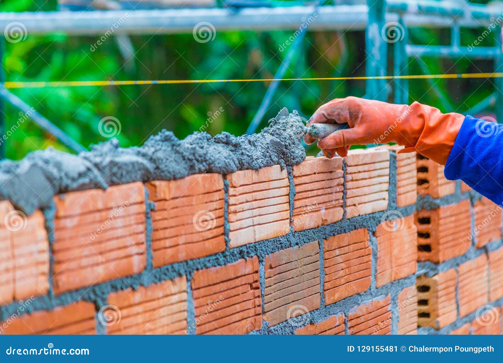 Hand Of Construction Worker Putting Down Mortar Paste On Top Of Royalty ...
