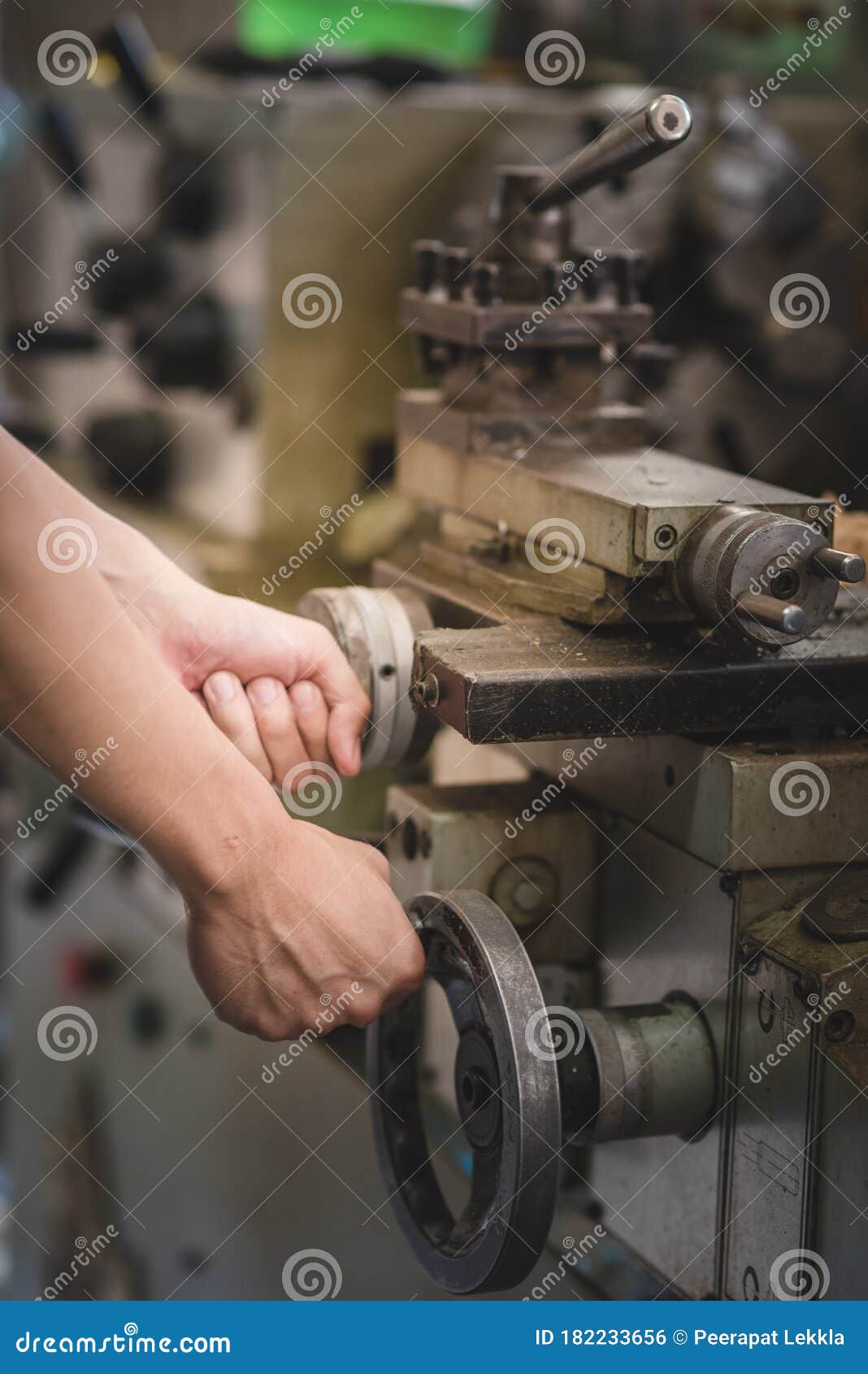 The Hand of the Controller Adjusting the Retro Lathe Machine in the ...