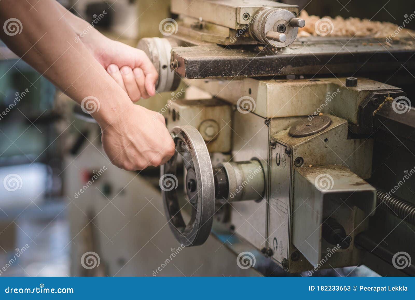 The Hand of the Controller Adjusting the Retro Lathe Machine in the ...