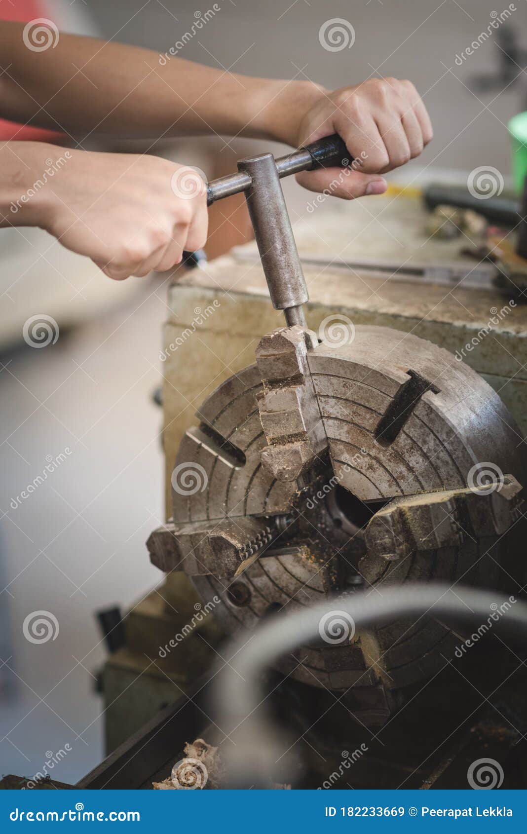 The Hand of the Controller Adjusting the Retro Lathe Machine in the ...