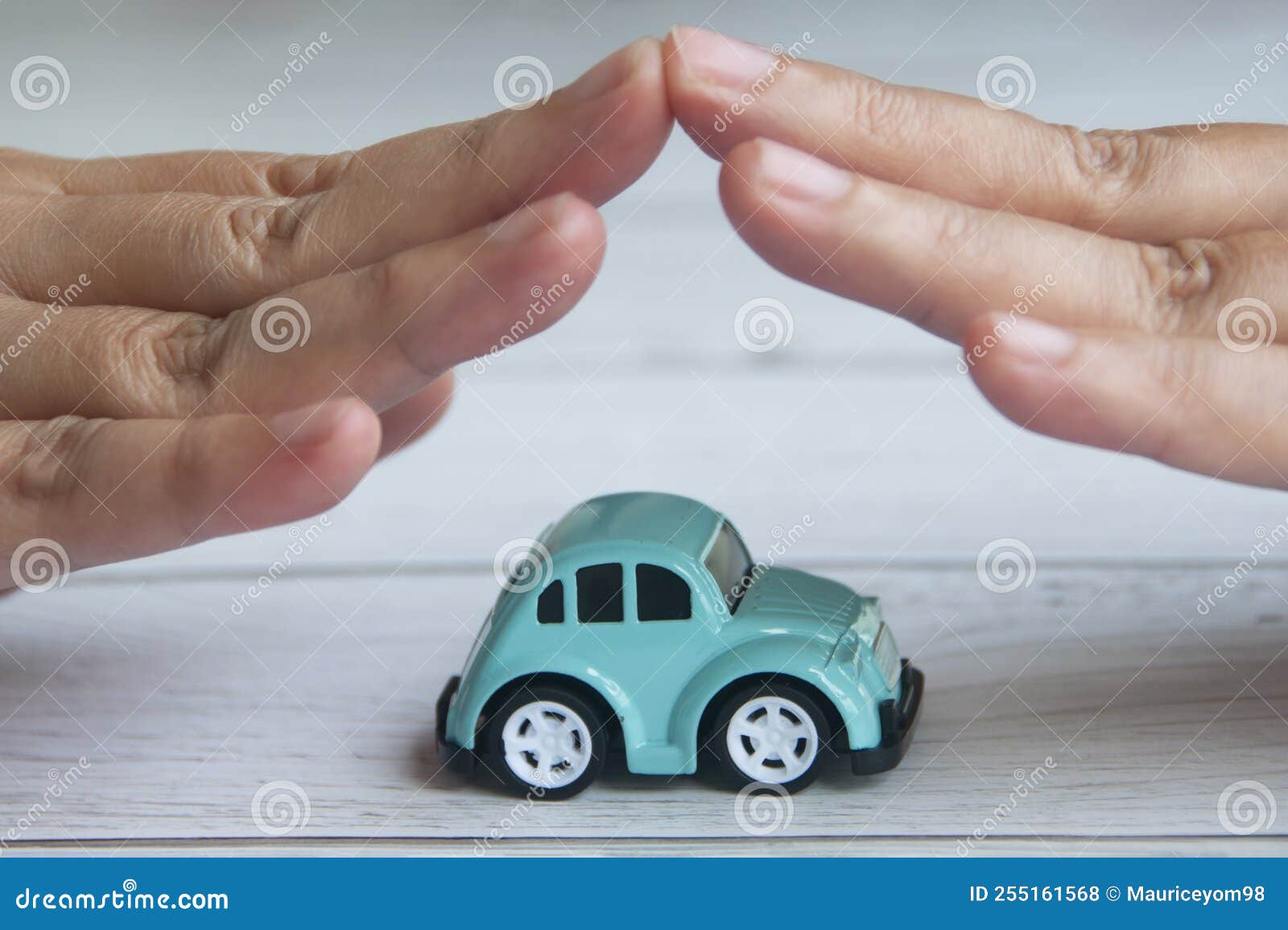 Hand Covering Toy Car - Insurance and Security Concept Stock Photo ...
