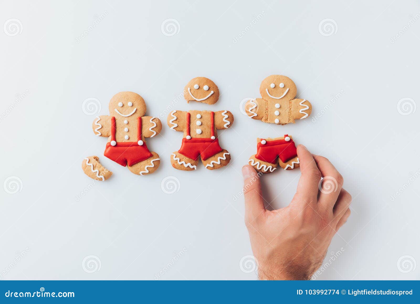 Hand with Crashed Gingerbread Men Stock Photo - Image of holiday, hand ...