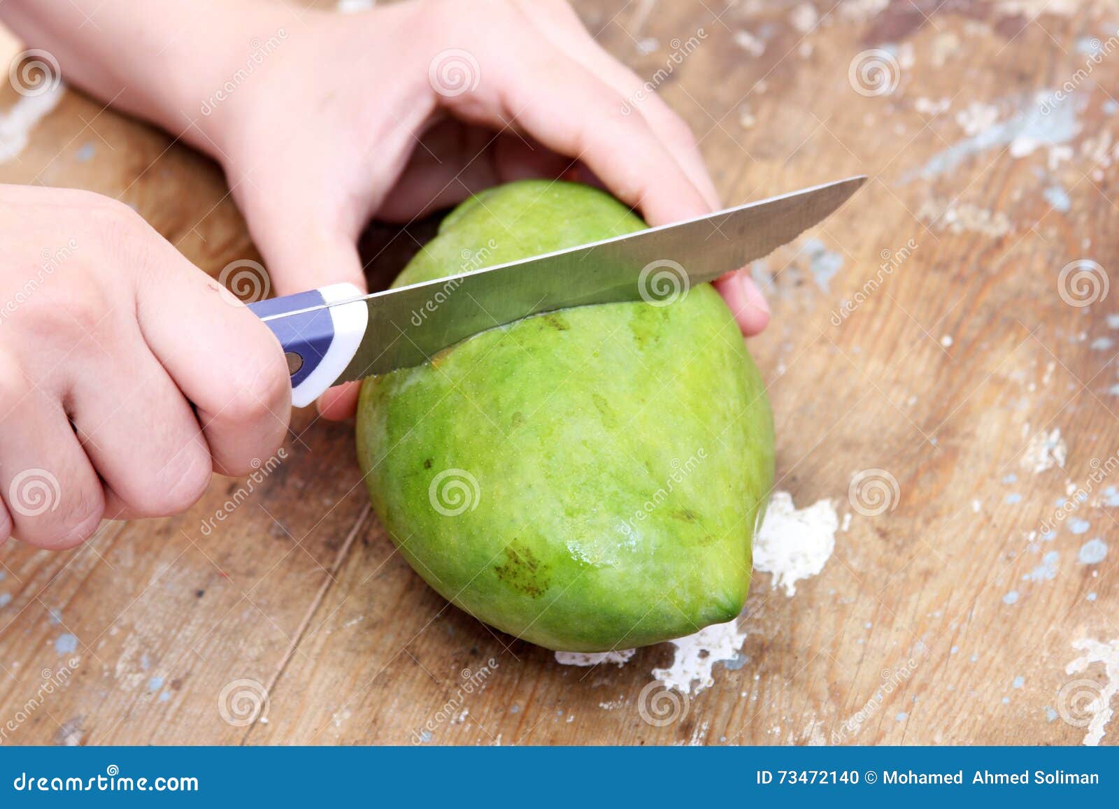 Hand cut mango stock photo. Image of sliced, background - 73472140