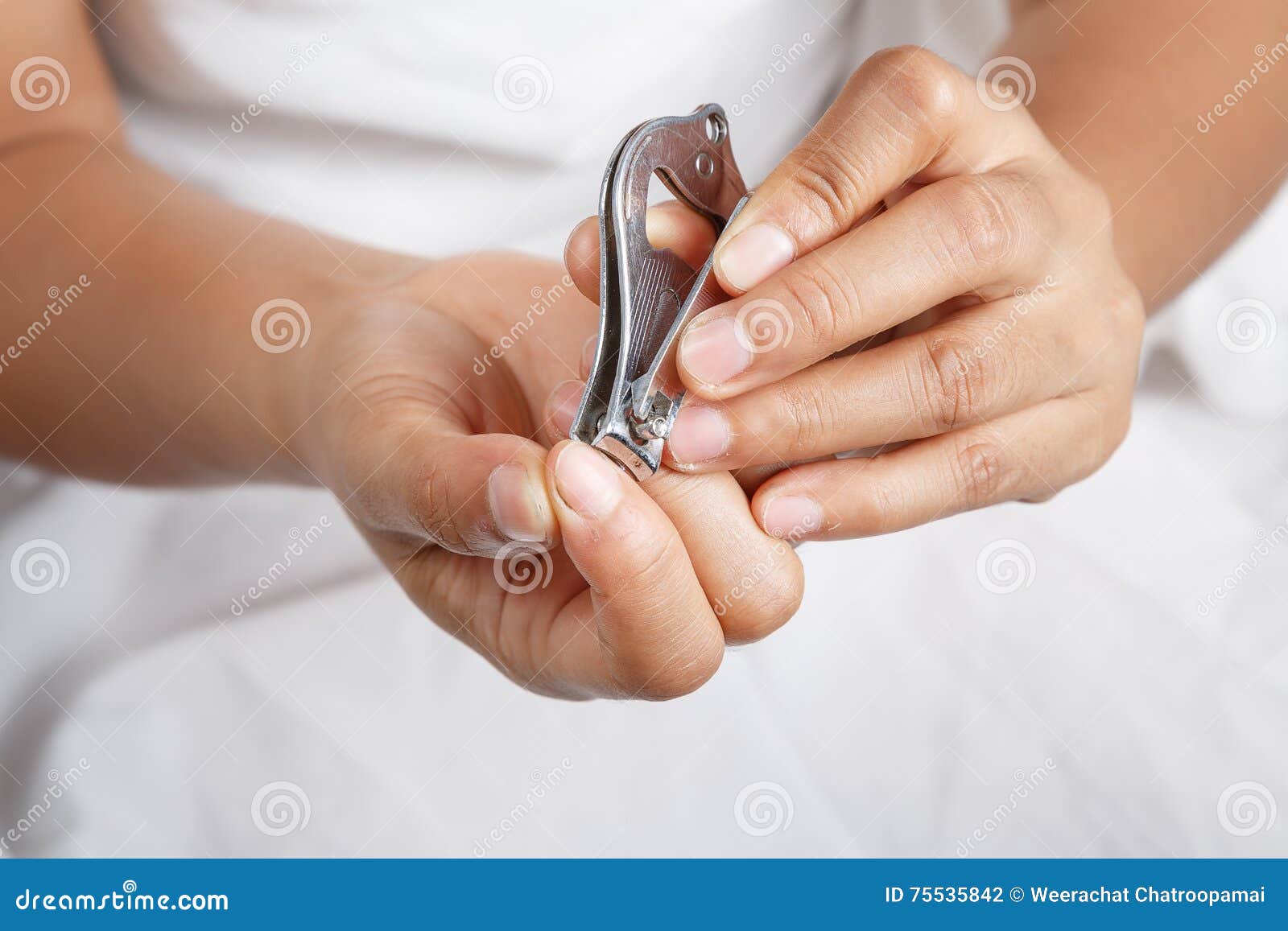Hand cutting fingernails stock photo. Image of girl, cuticle - 75535842