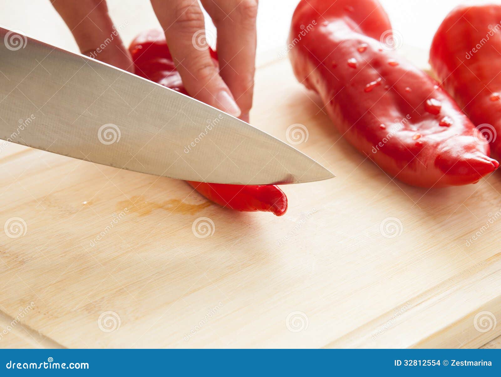 Hand Cutting Ripe Red Pepper Stock Photo - Image of finger, cook: 32812554