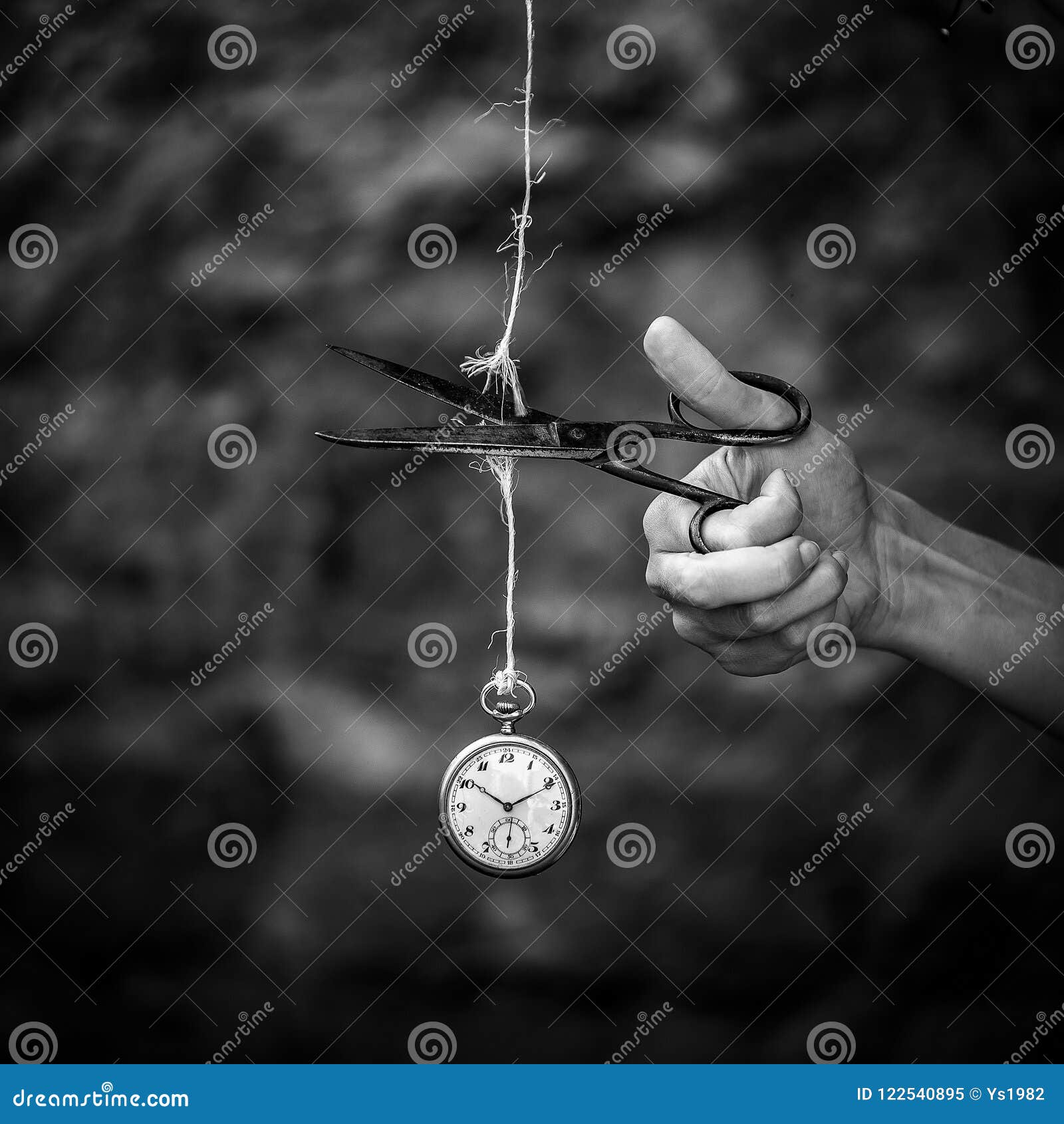 Hand Cutting a Rope with a Clock - Importance of Time Stock Image ...