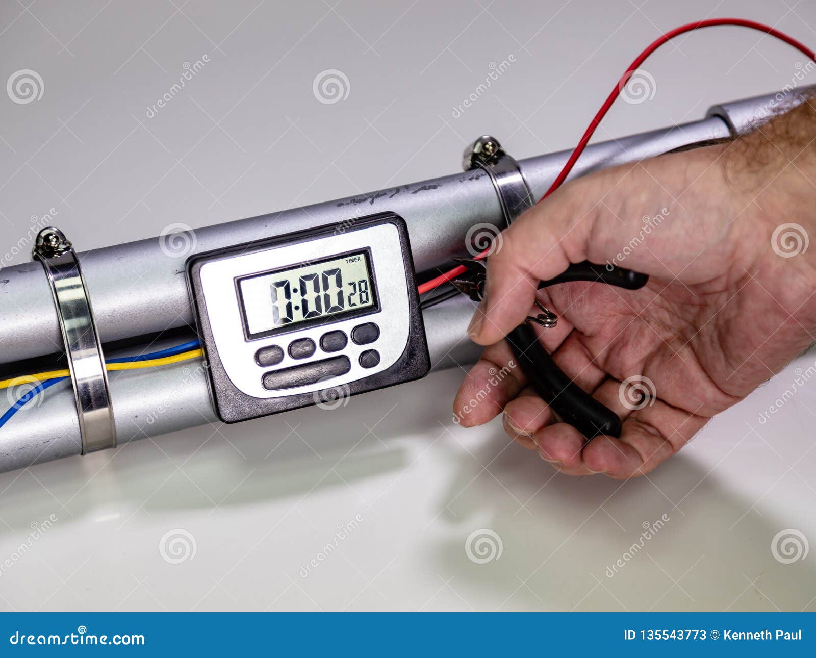 Hand Cutting Wire on Pipe Bomb on White Background Editorial Stock ...