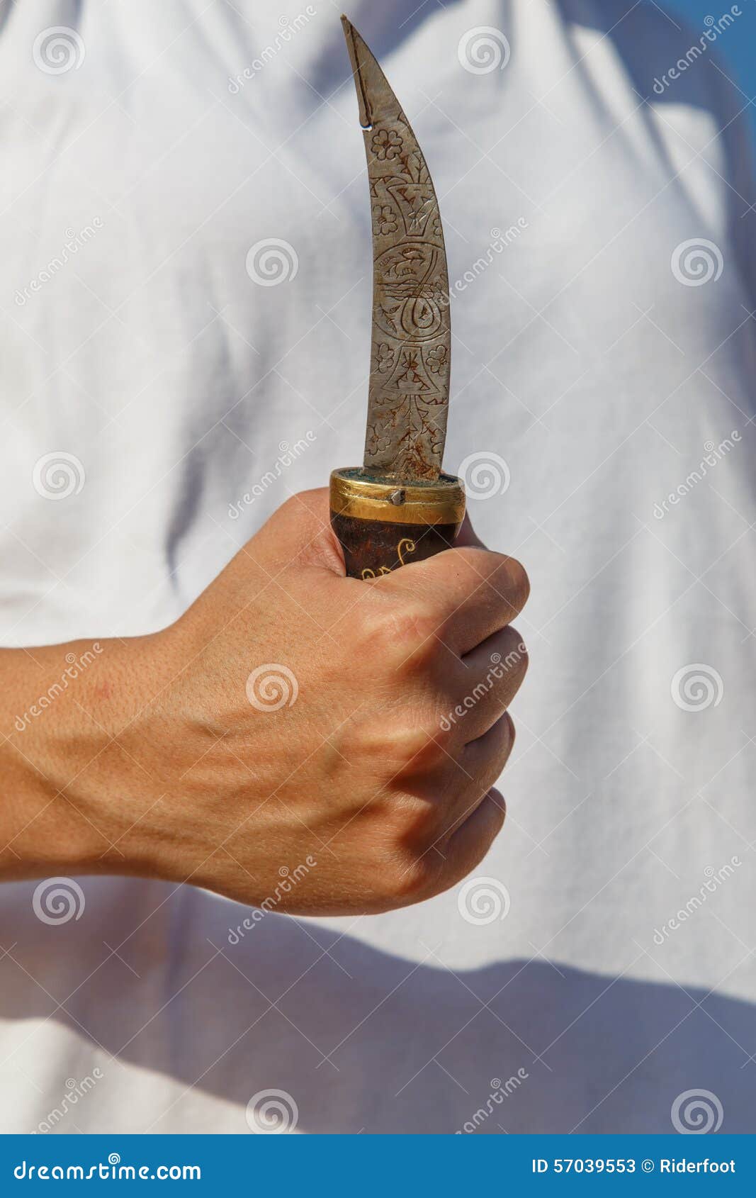 Hand with a dagger knife stock image. Image of caucasian - 57039553