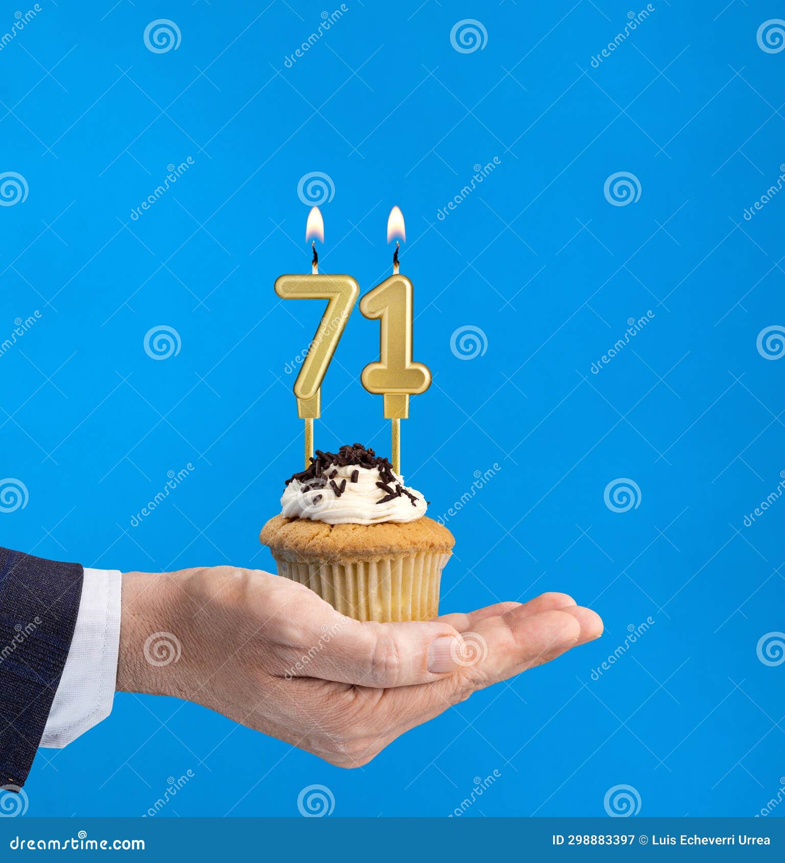 Hand Delivering Birthday Cupcake - Candle Number 71 on Blue Background ...