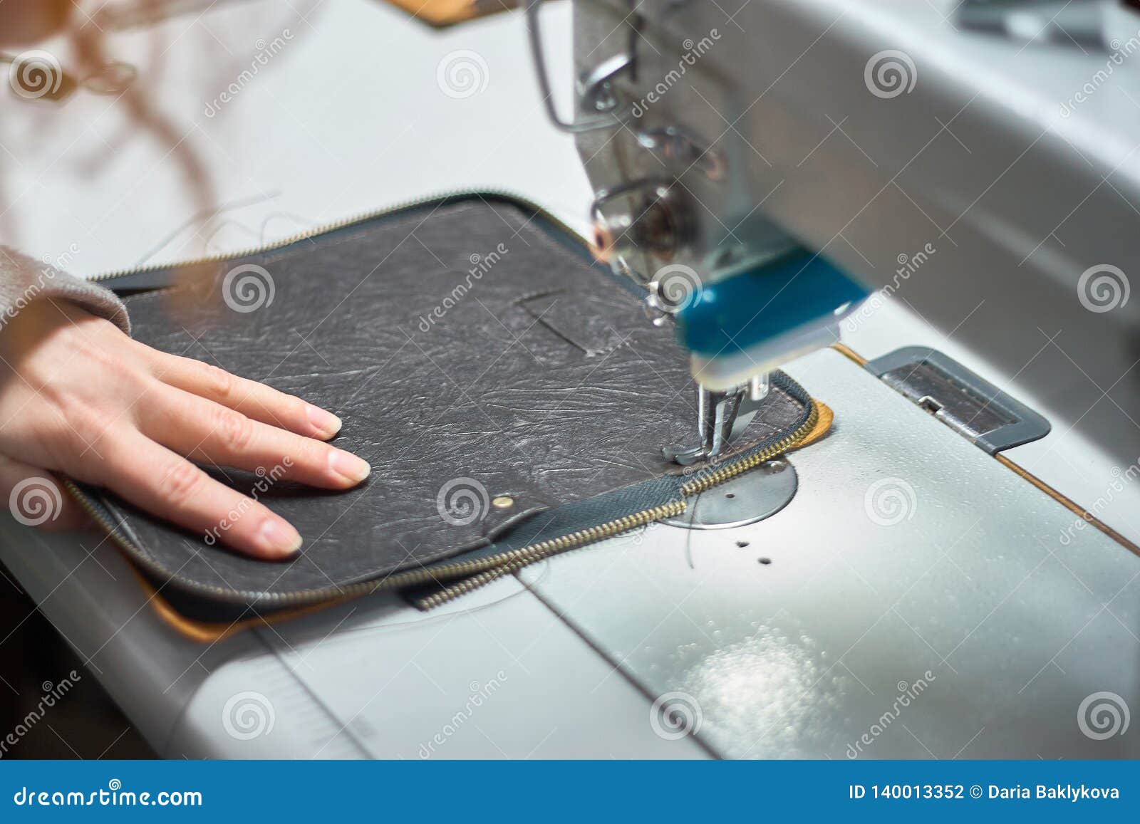 The Hand of a Designer Who Stitching a Fragment of a Bag Stock Photo ...