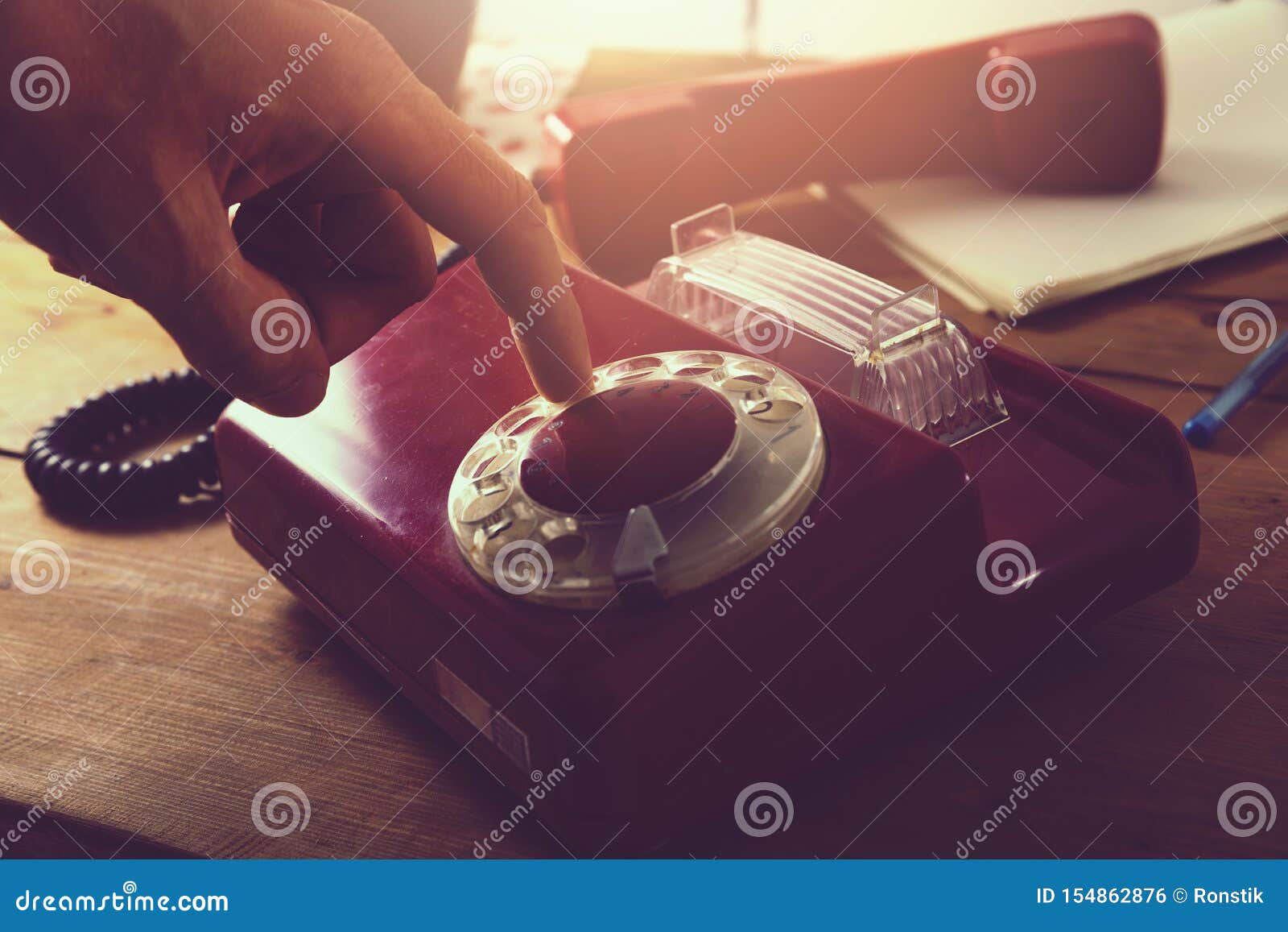 Hand Dialing Old Retro Rotary Phone on Wooden Table Stock Photo - Image ...