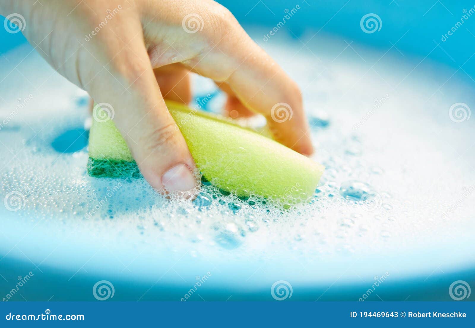 Hand Dips Sponge in Soapy Water while Cleaning House Stock Image ...