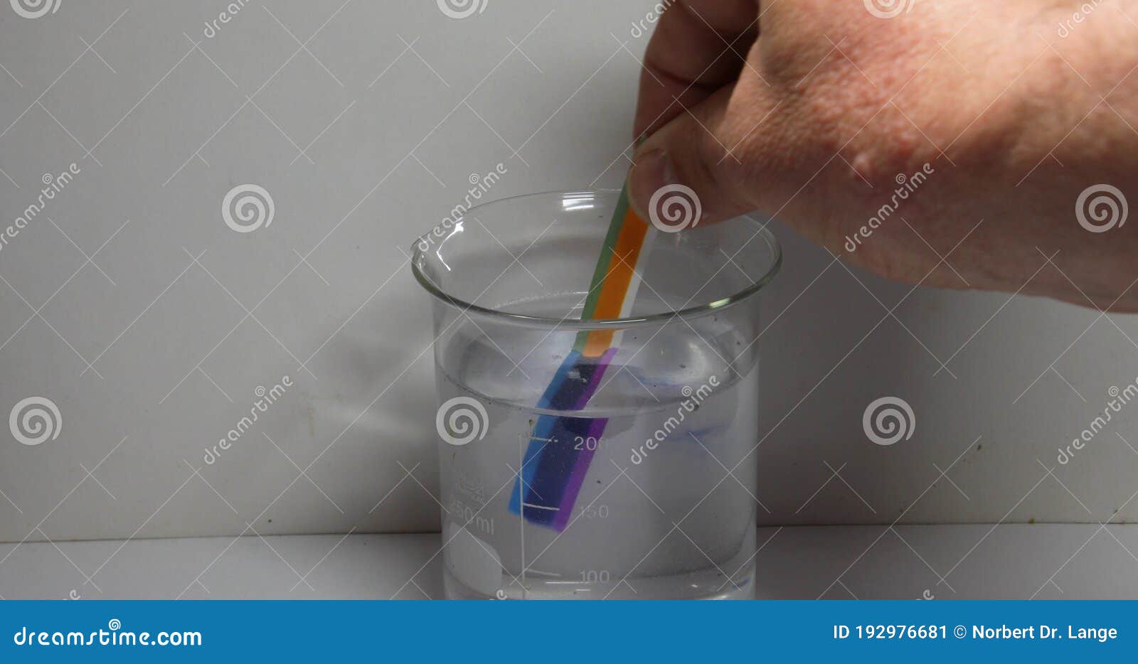 Hand Dips a Test Strip into a Solution in a Beaker Stock Image - Image ...