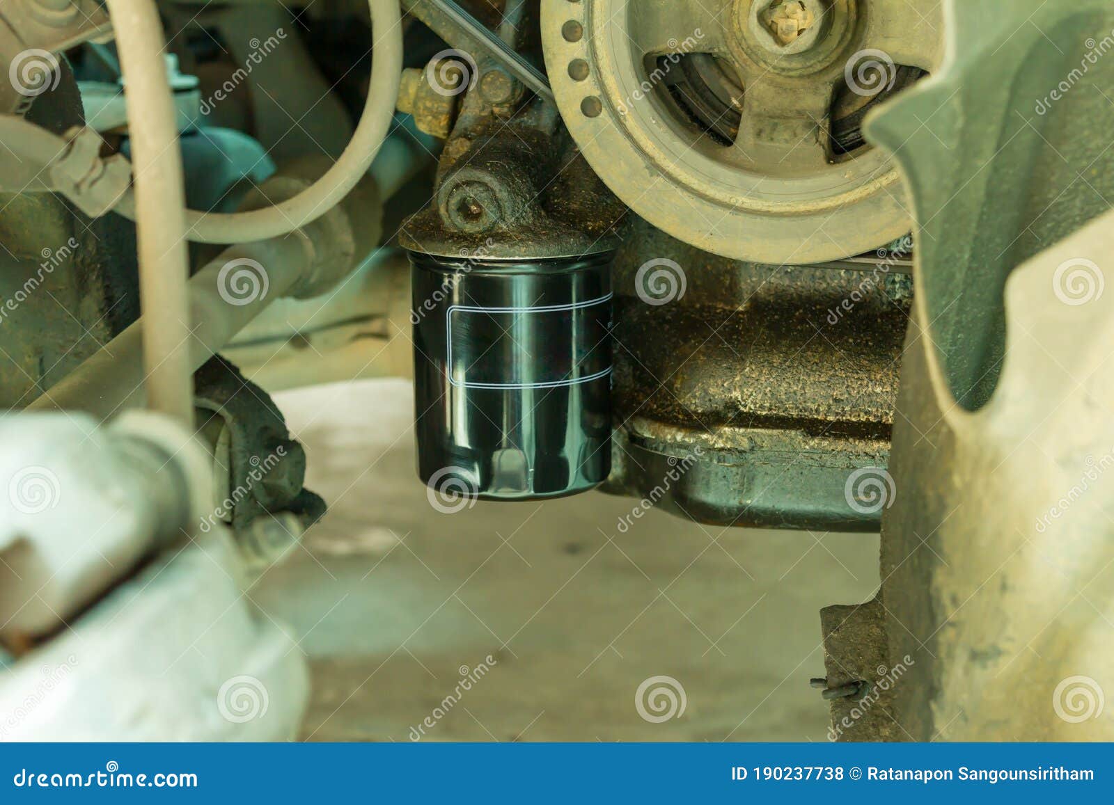 Hand are Disassembled Oil Filter Under the Car Engine. Stock Photo ...