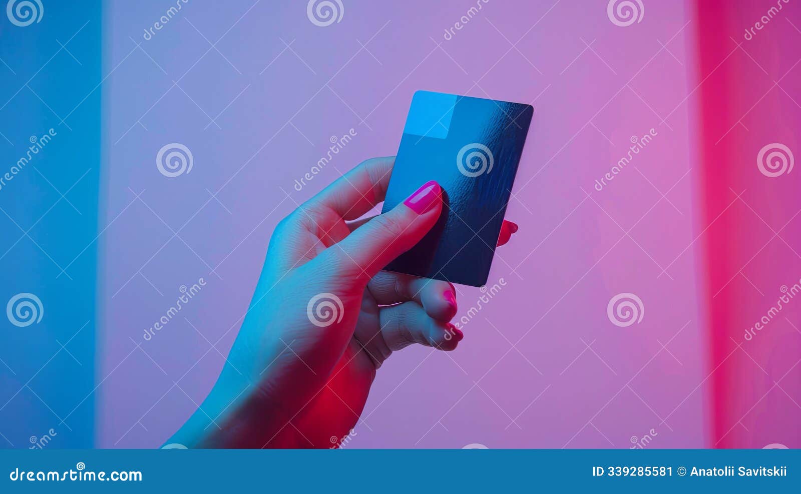 A Hand Displays a Blank Card, Glowing in Blue and Pink Lighting ...