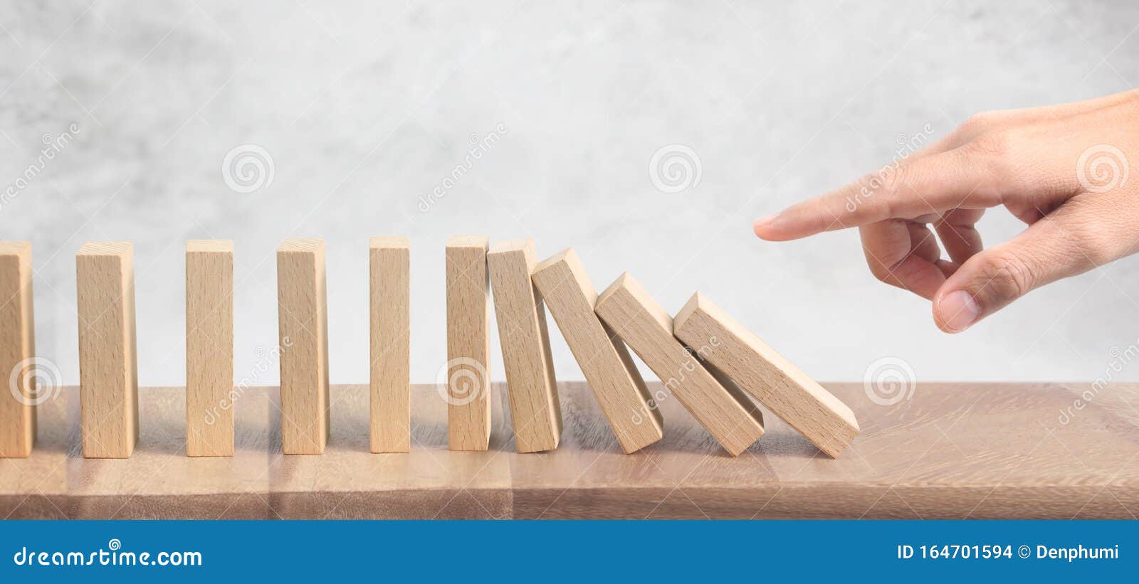 Hand and Domino Effect Stopped by Unique Stock Photo - Image of problem ...