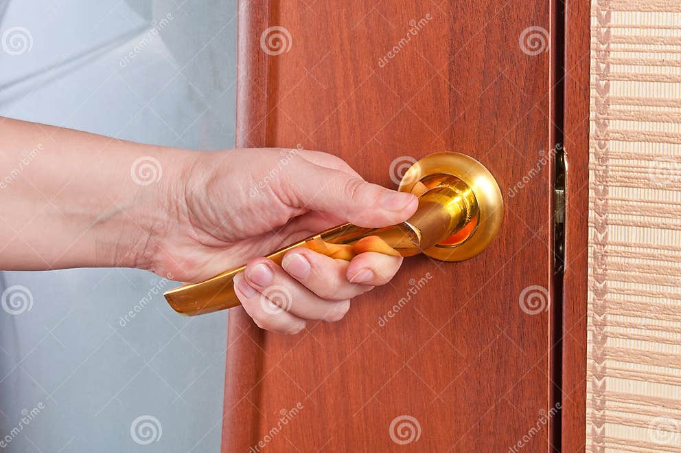 Hand and the door handle stock image. Image of doorknob - 23264705