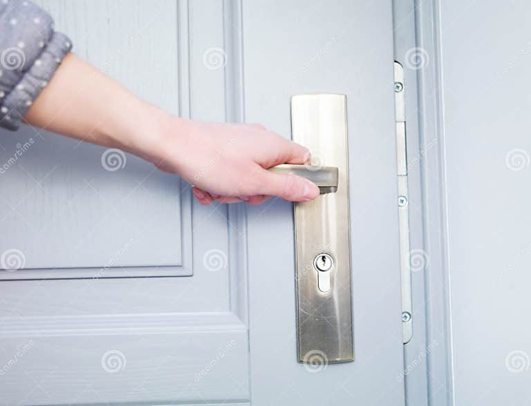 Hand and the door handle stock photo. Image of background - 89792500