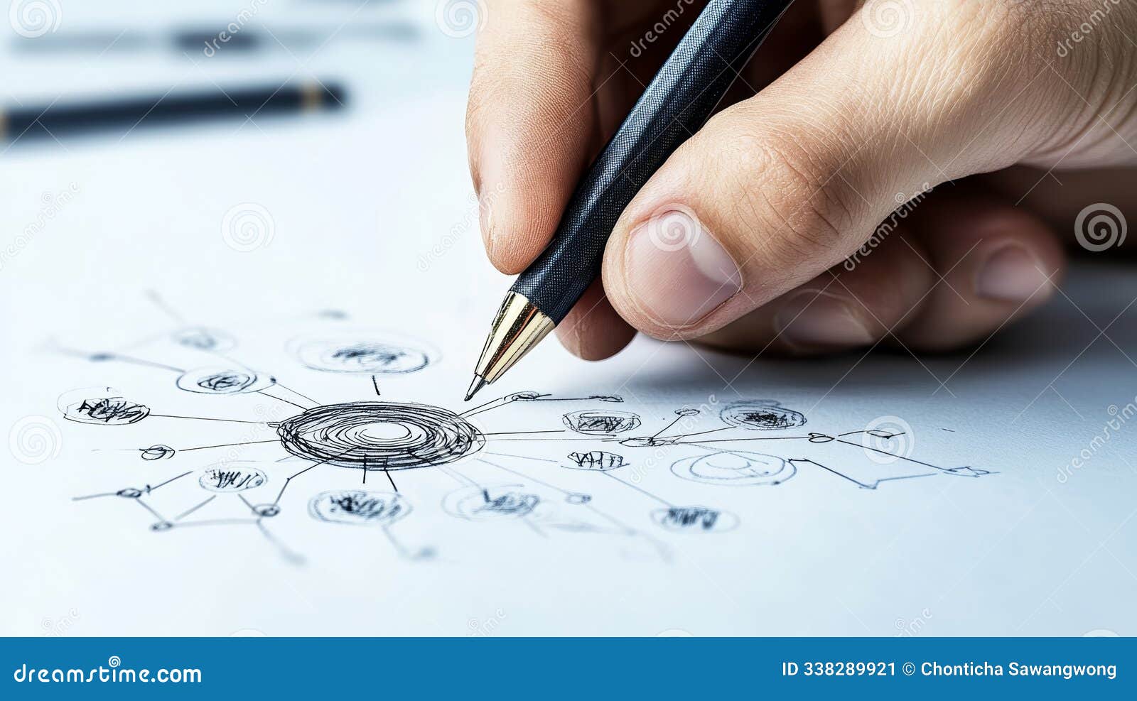 A Hand Draws A Mind Map On Paper With A Pen, Representing Brainstorming ...