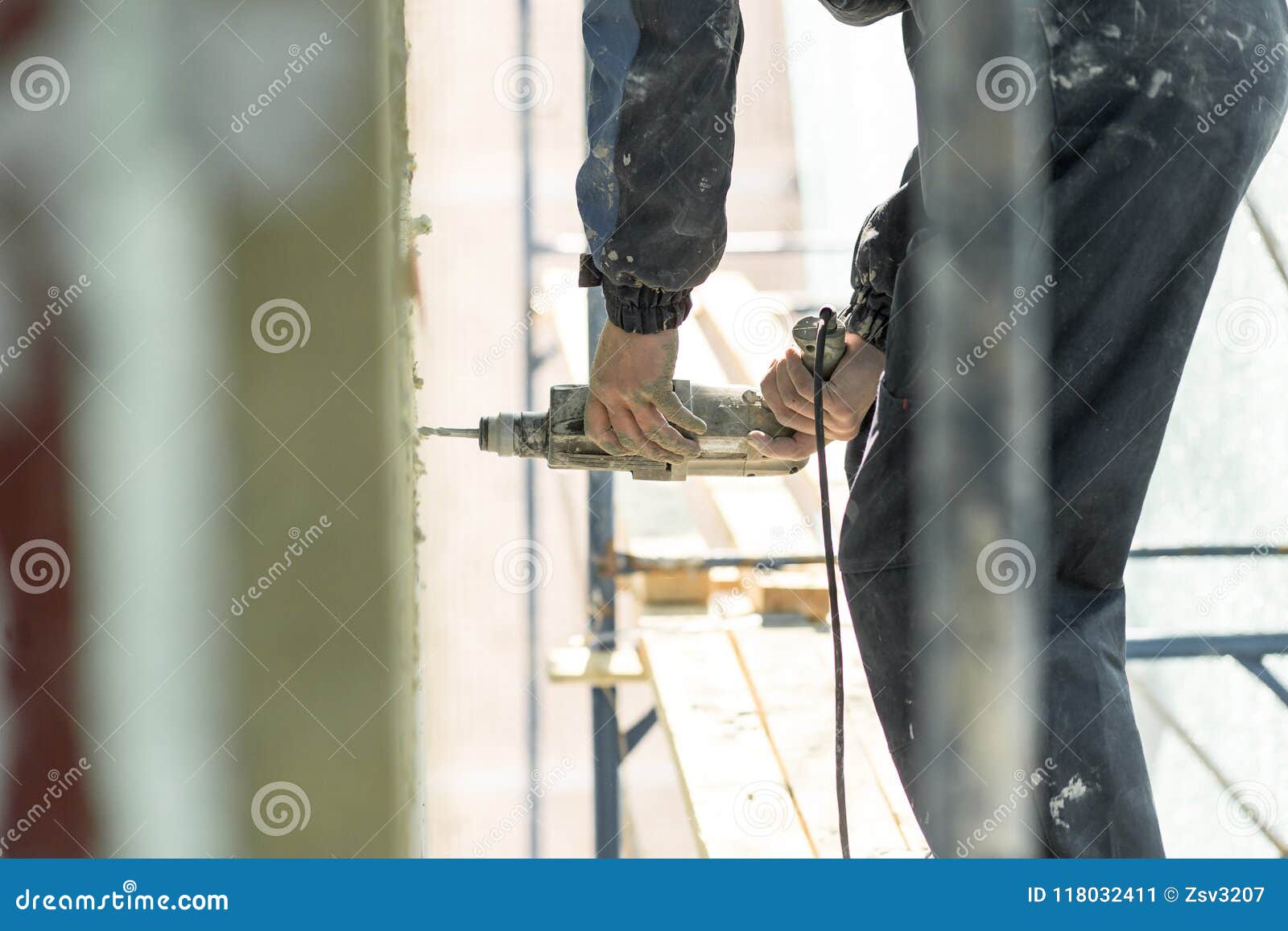 Hand Drilling on the Scaffolding on Altitude. Concept Repairing the ...