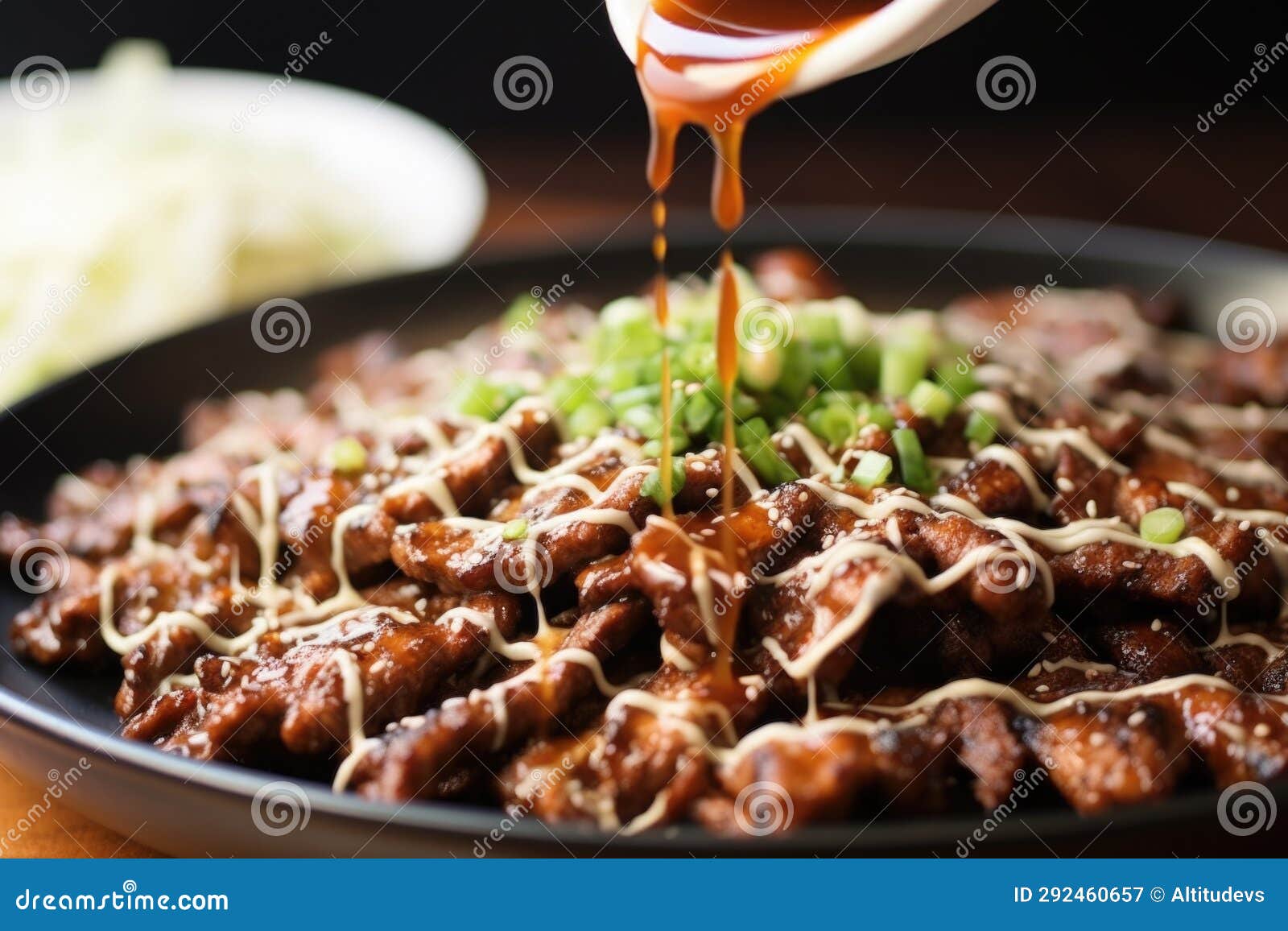 Hand Drizzling Sauce Over Grilled Bulgogi Strips Stock Image - Image of ...