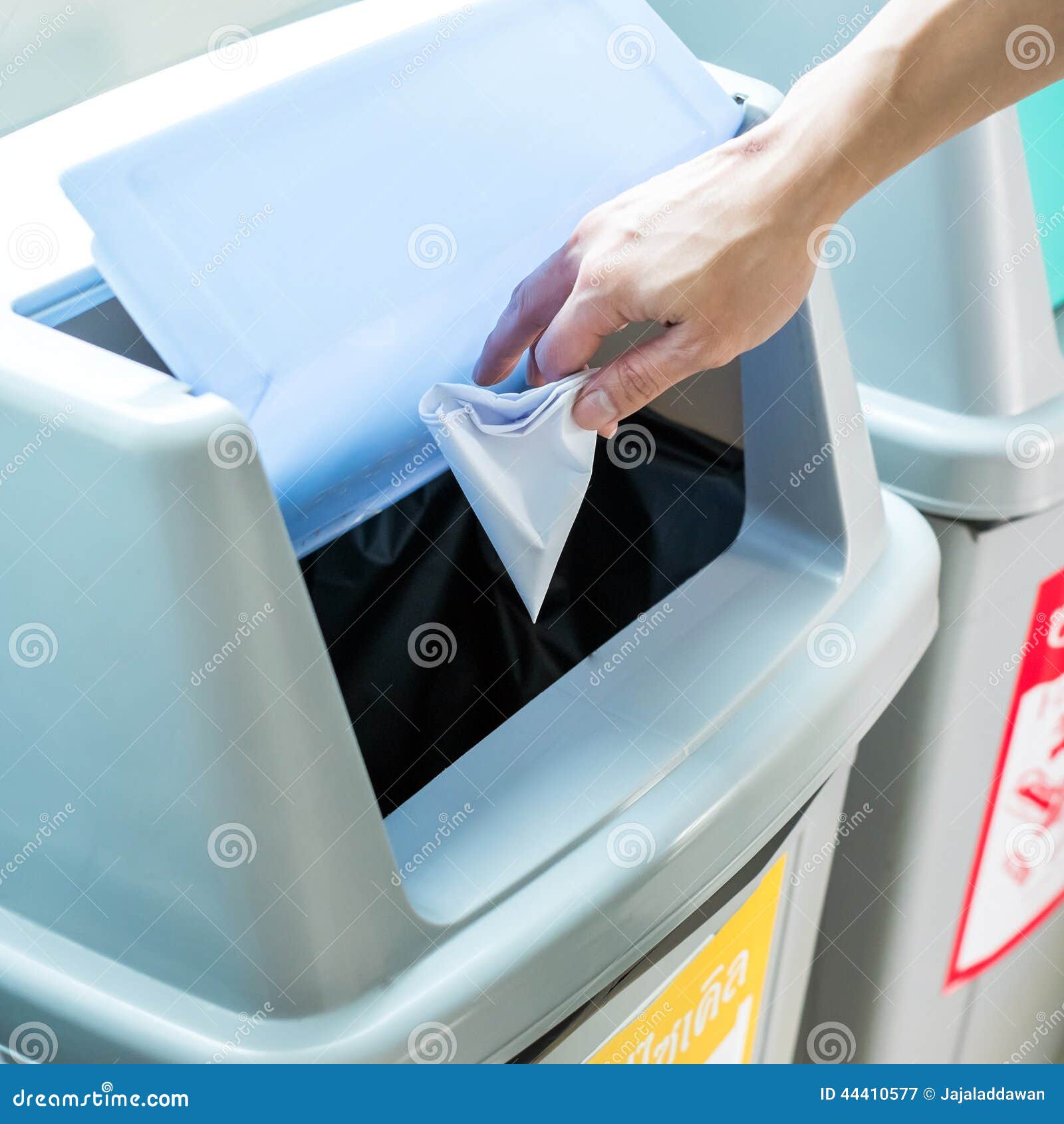Hand Dropping Crumpled Paper Stock Image - Image of discard, waste ...