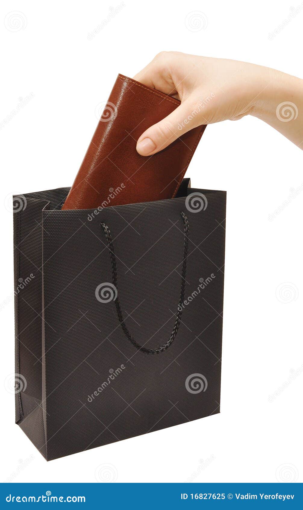 Hand Dropping a Purse Inside a Black Bag Stock Image - Image of ...