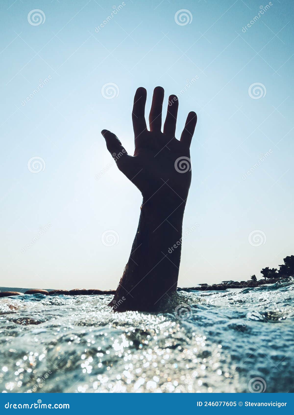 Hand of a Drowning Man Reaching Out from the Deep Cold Sea Water and ...