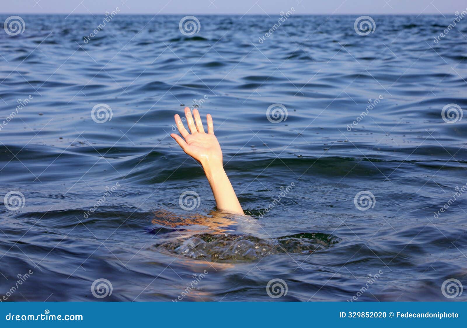 Hand is Drowning in the Middle of the Sea and is Reaching Out for Help ...