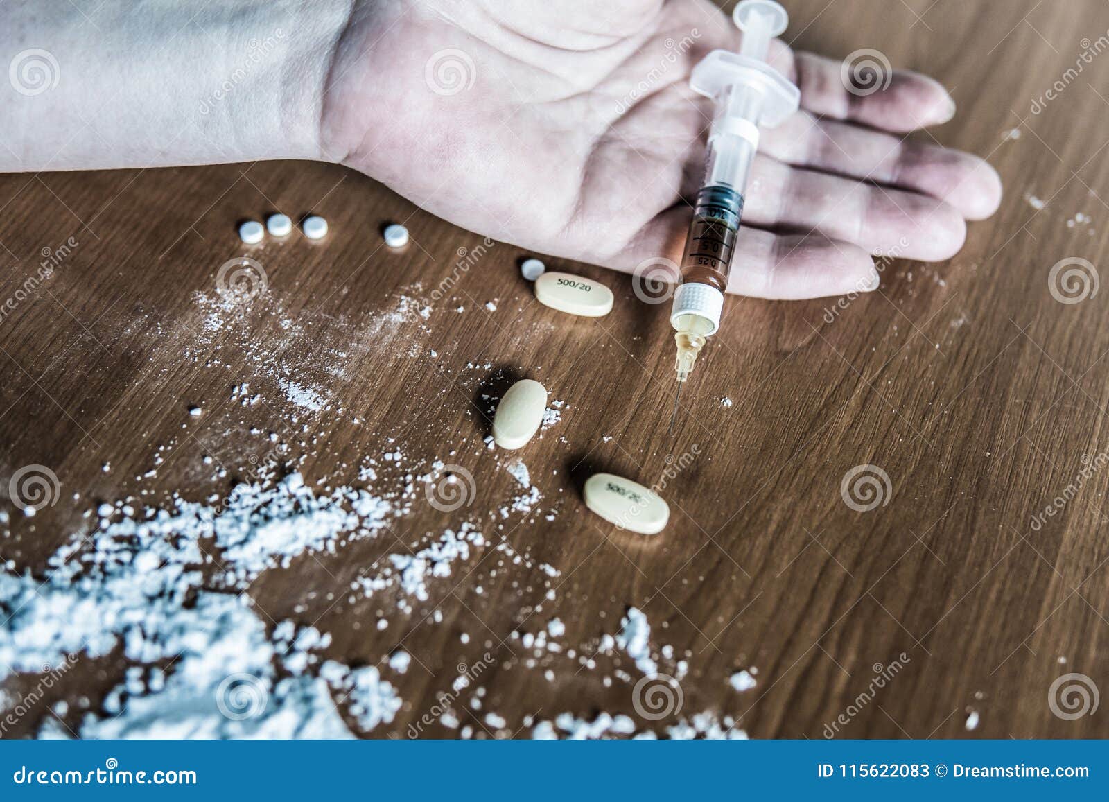 Hand of Drug Abuser on the Floor with Different Drugs. Stock Image ...