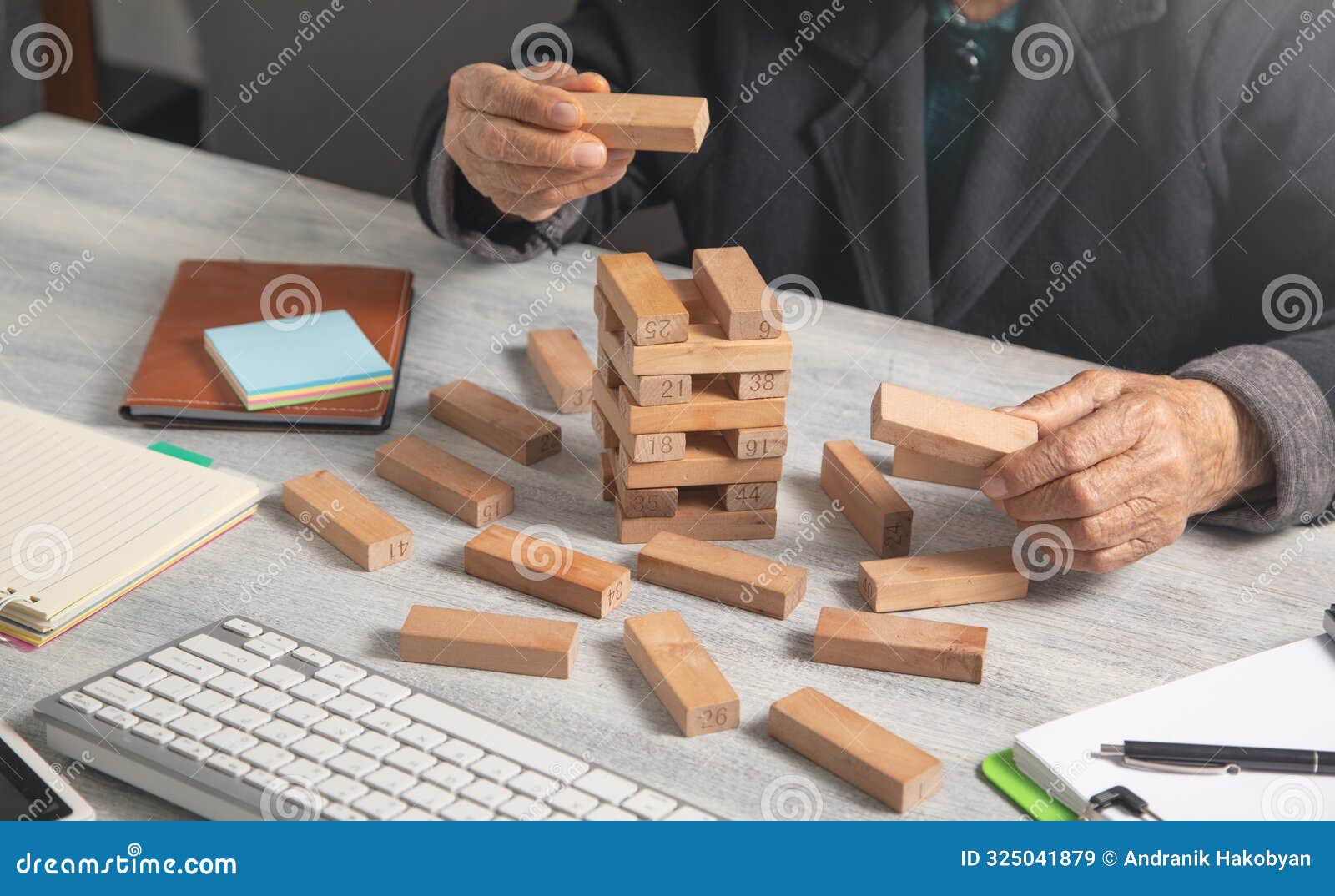 Hand of Elderly Woman Stacking Wooden Blocks Stock Image - Image of ...