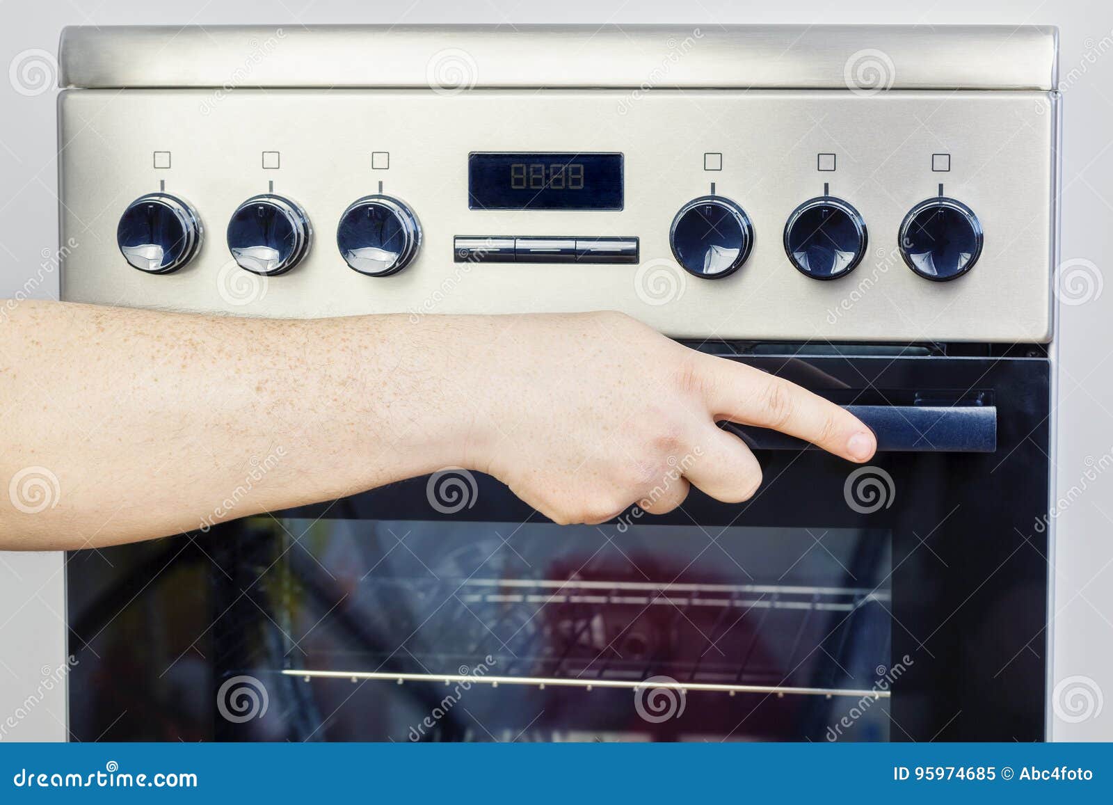 Hand on electric cooker stock image. Image of meal, person - 95974685