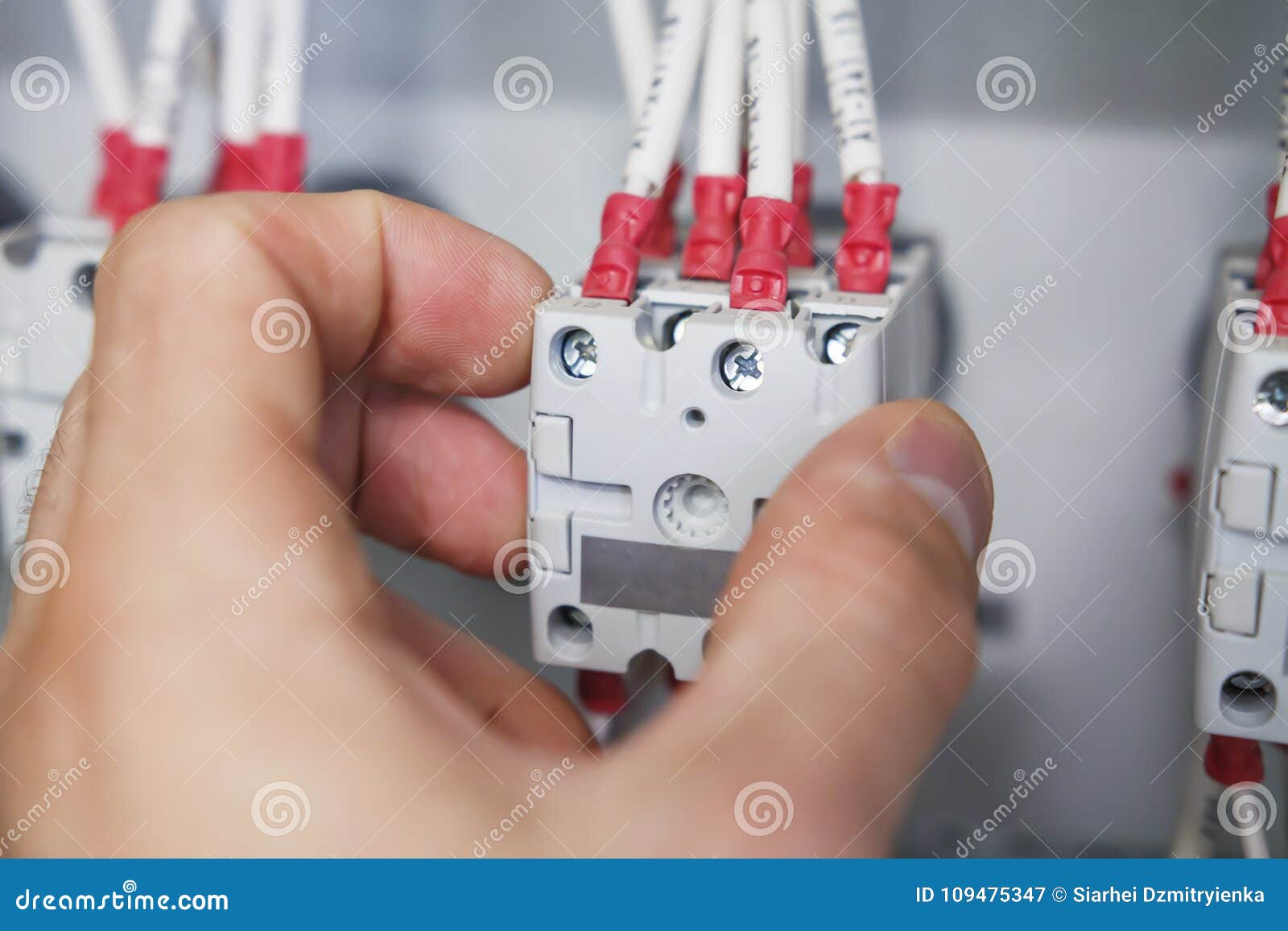 Hand of Electrician Installs Package Switch with Connected Wires in ...