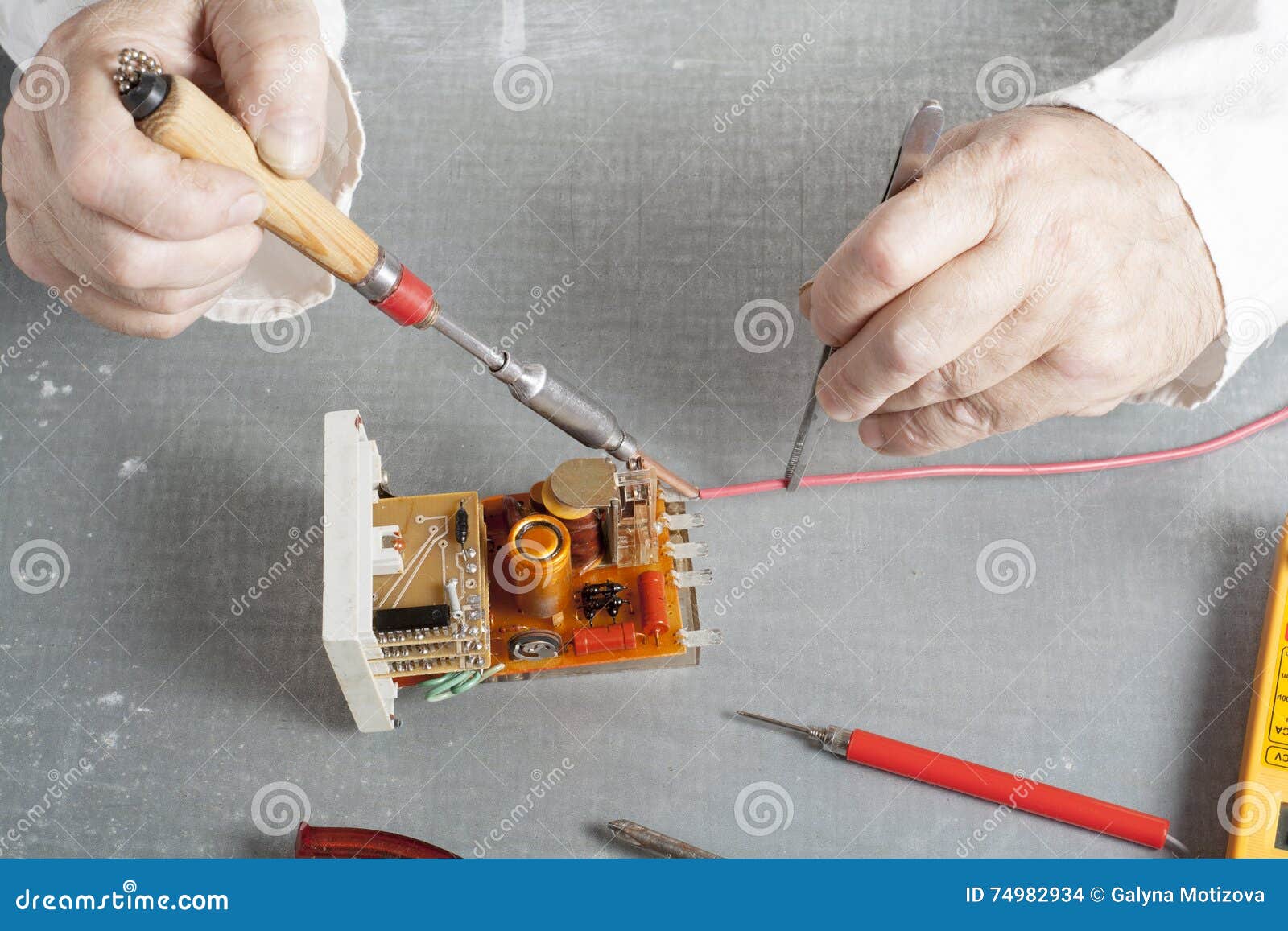 Hand of Electrician with Multimeter Probe at Electrical Switchgear ...
