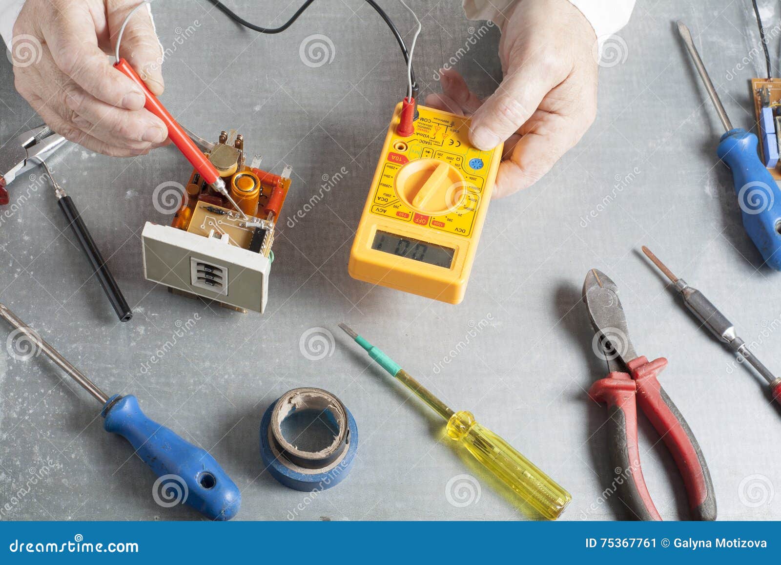Hand of Electrician with Multimeter Probe at Electrical Switchgear ...