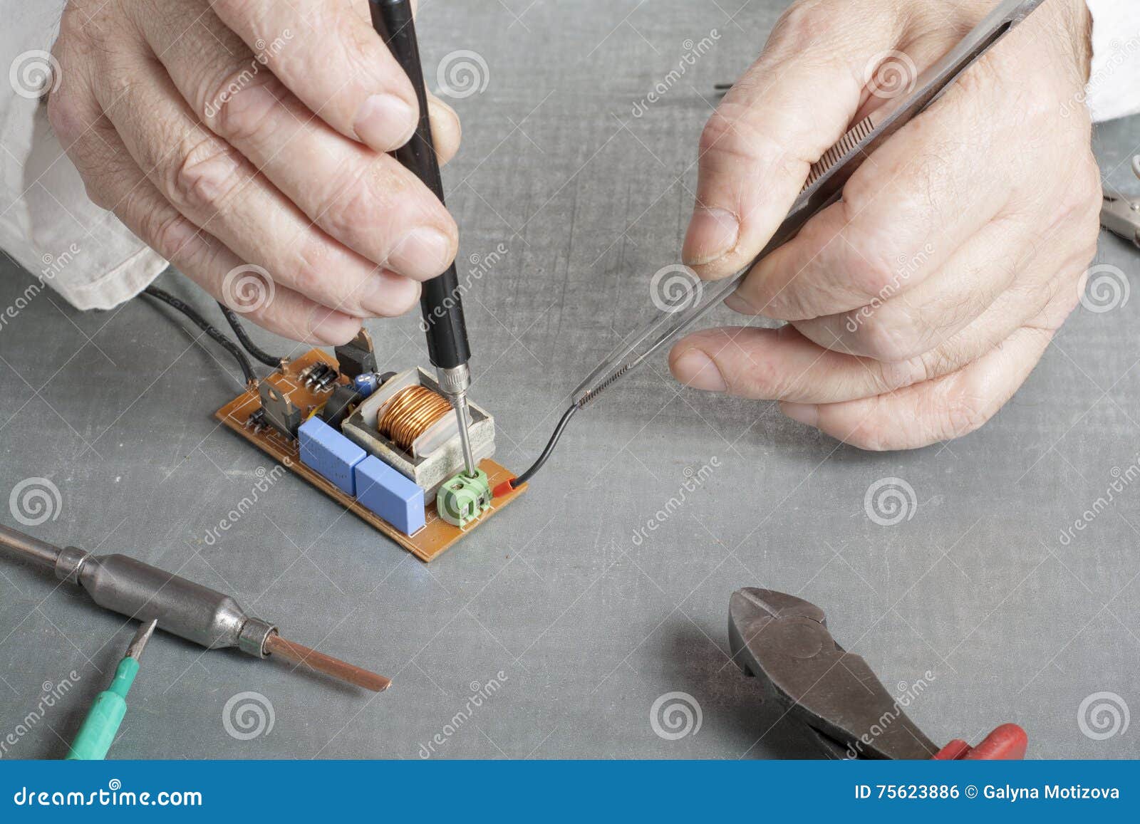 Hand of Electrician with Multimeter Probe at Electrical Switchgear ...