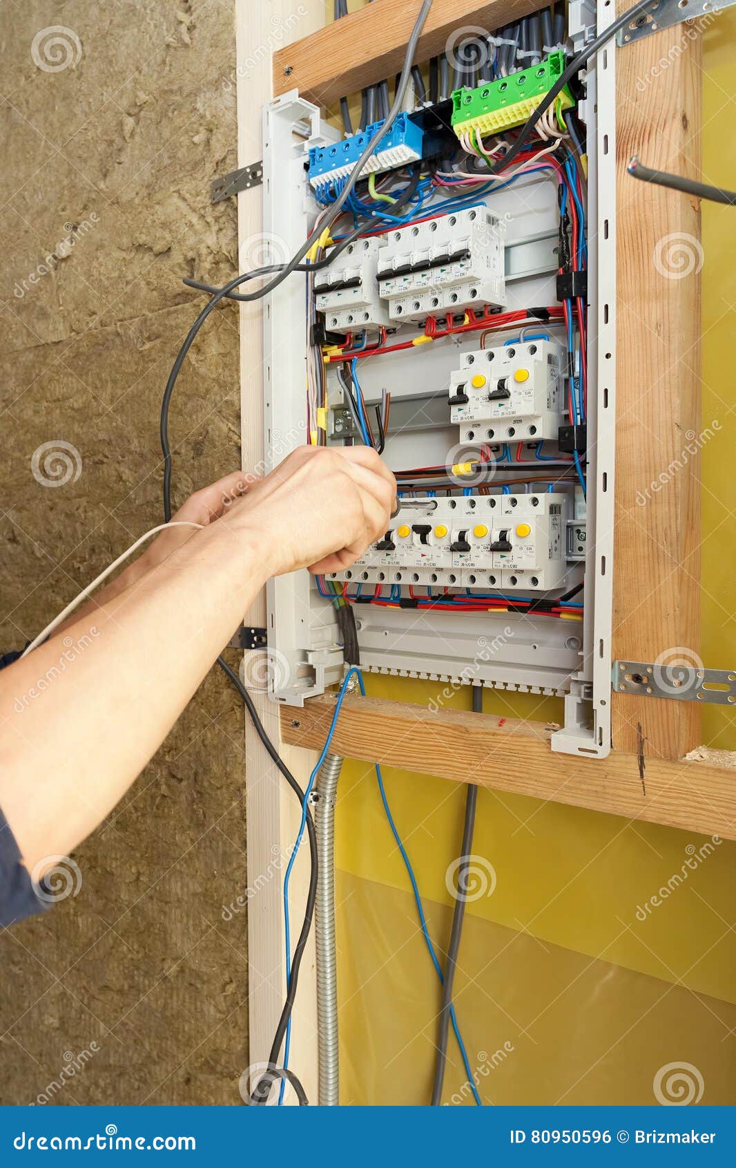 Hand of an Electrician with Screwdriver at an Electrical Switchgear ...